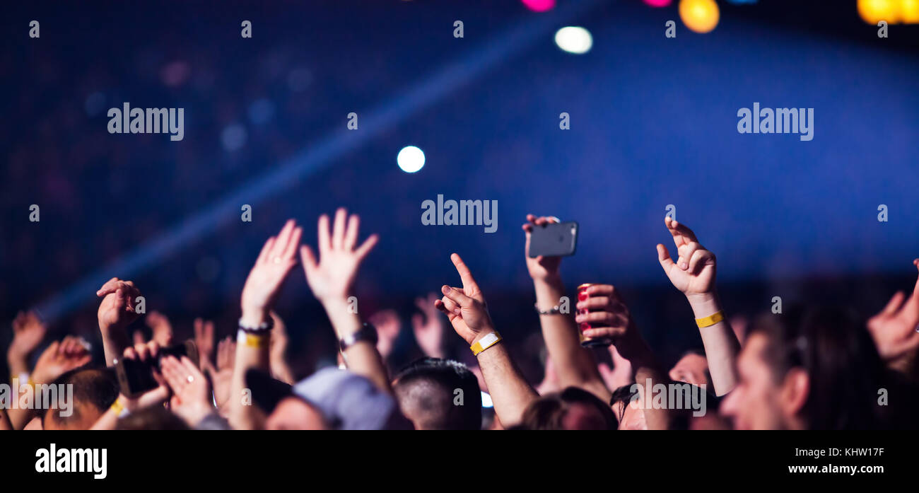 raised hands and concert lights Stock Photo - Alamy