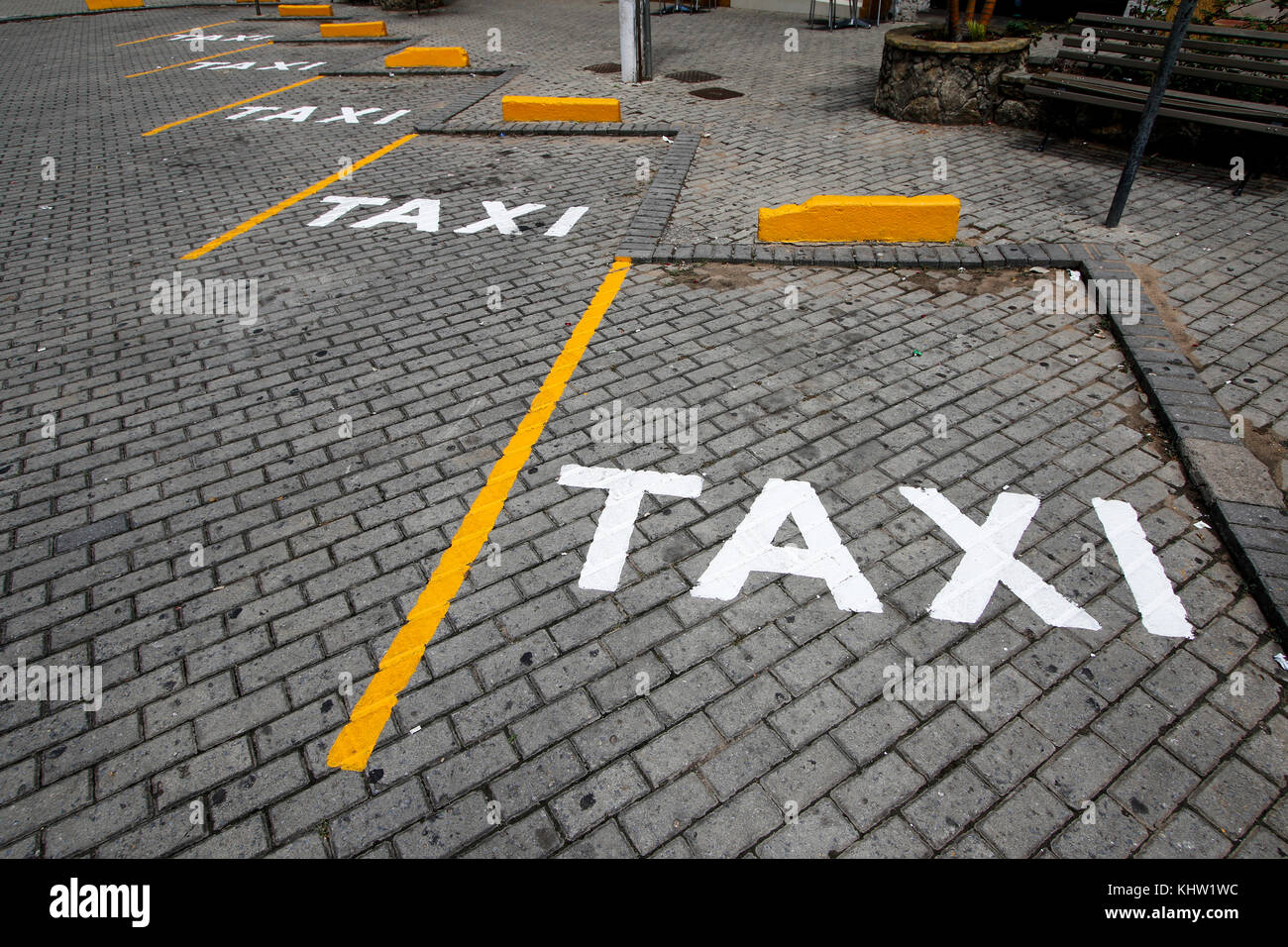 Taxi sign posted in public way with white paint Stock Photo - Alamy