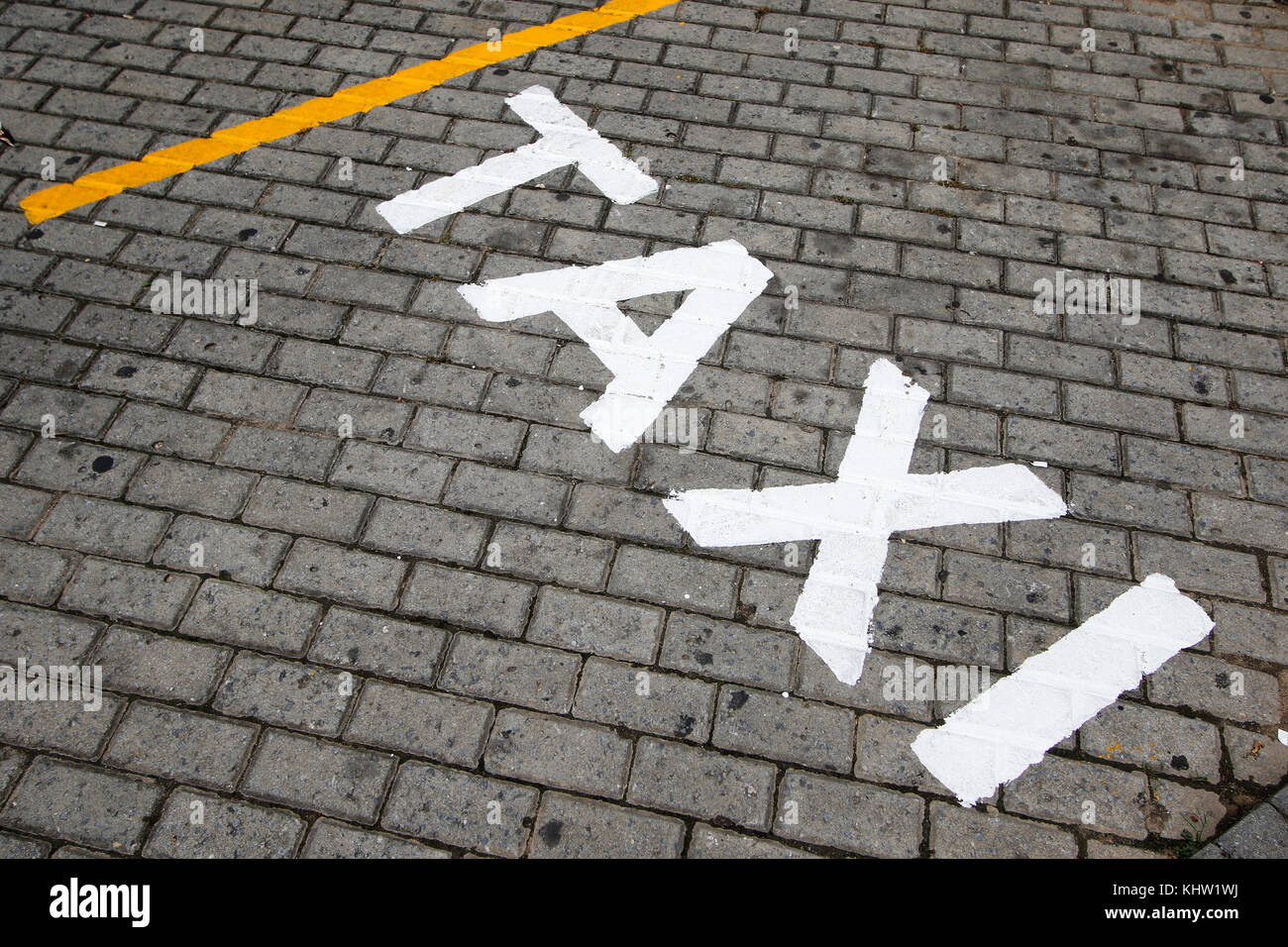 Taxi sign posted in public way with white paint Stock Photo - Alamy
