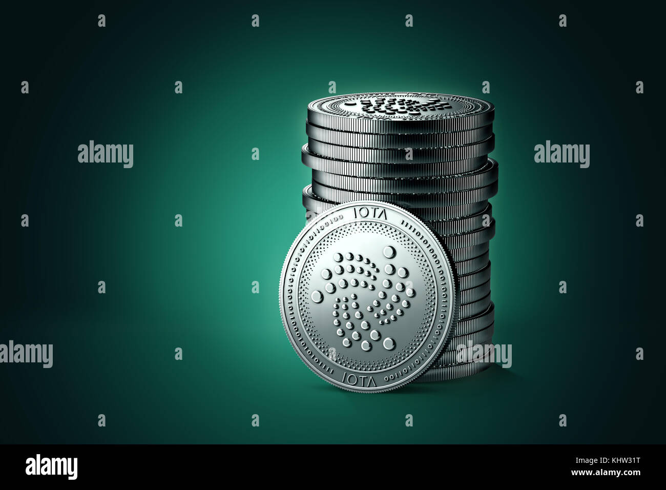 Pile or stack of silver IOTA coins on gently lit green blue background ...