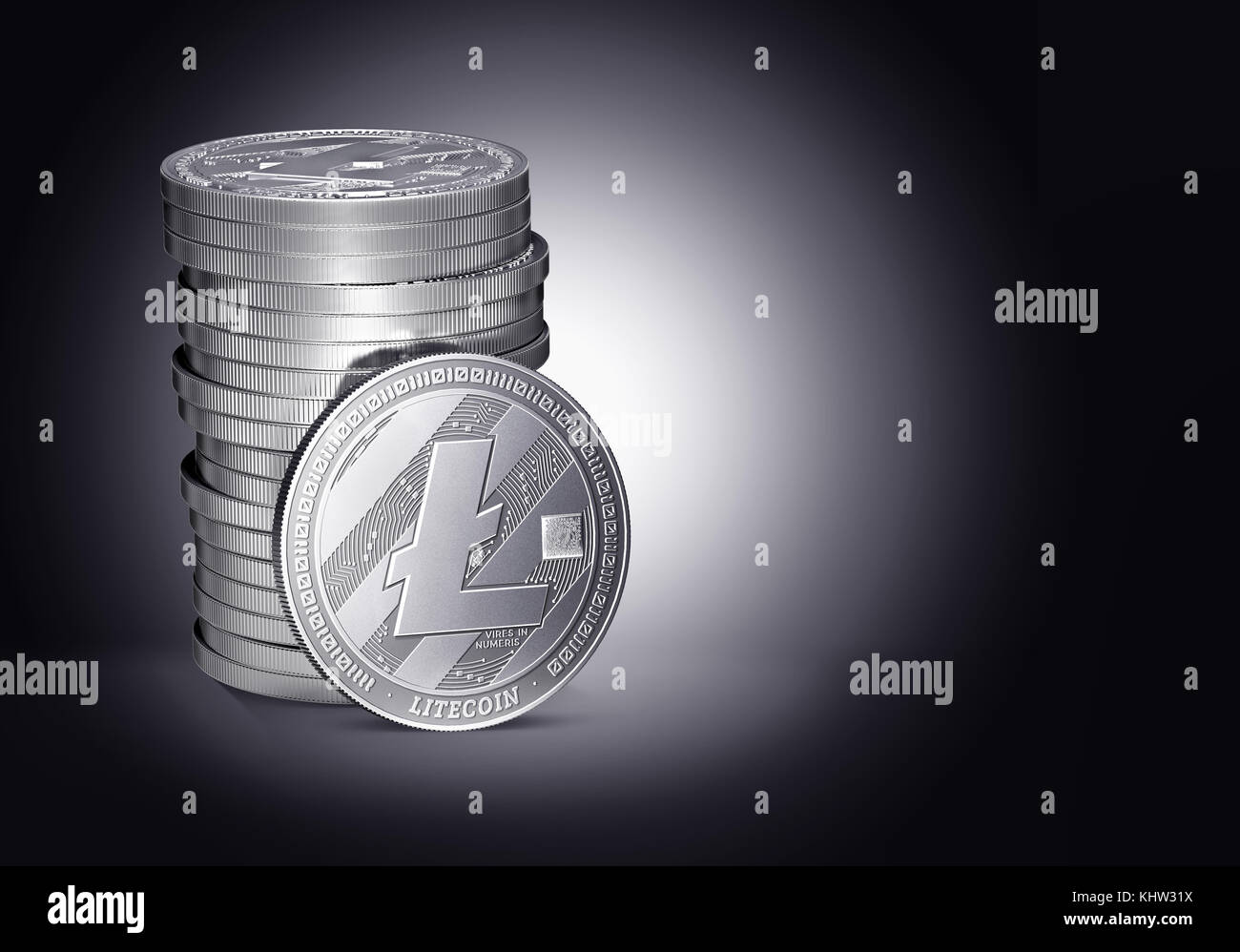 Pile or stack of silver Litecoin coins on gently lit dark blue ...