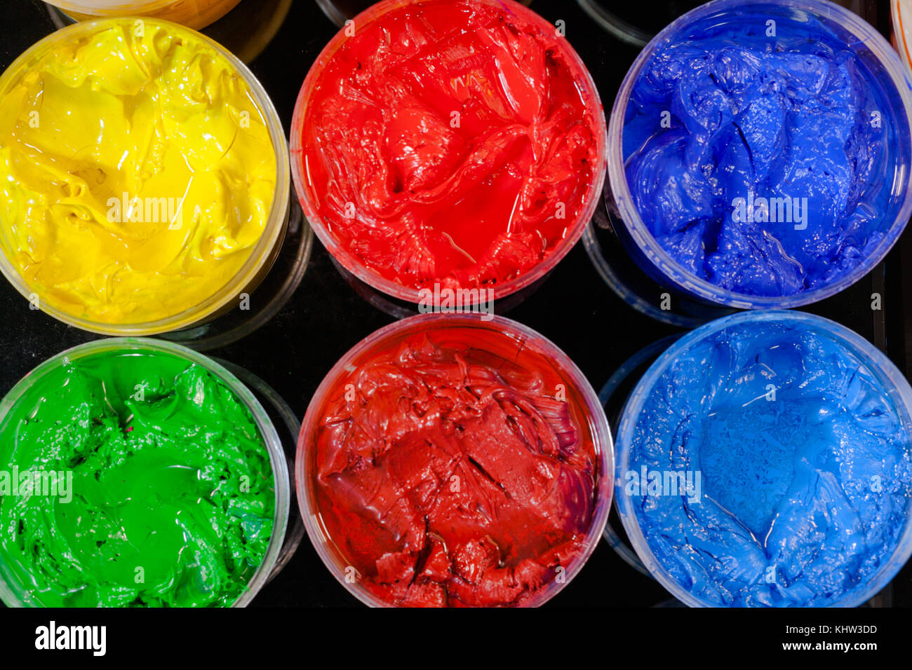 several plastisol ink cans in factory who use plastisol ink to Stock ...