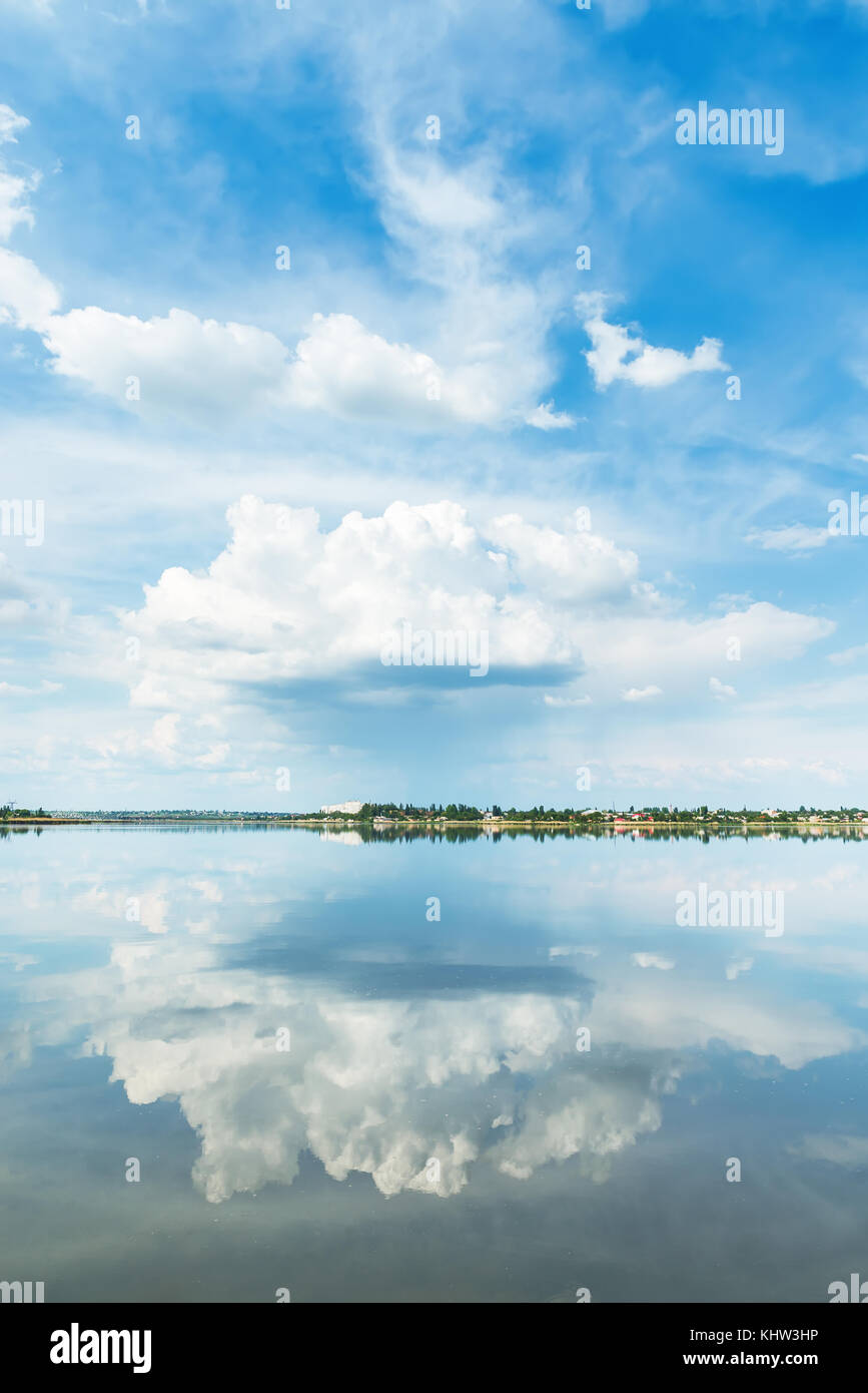 one big cloud in blue sky and it reflection in river Stock Photo - Alamy