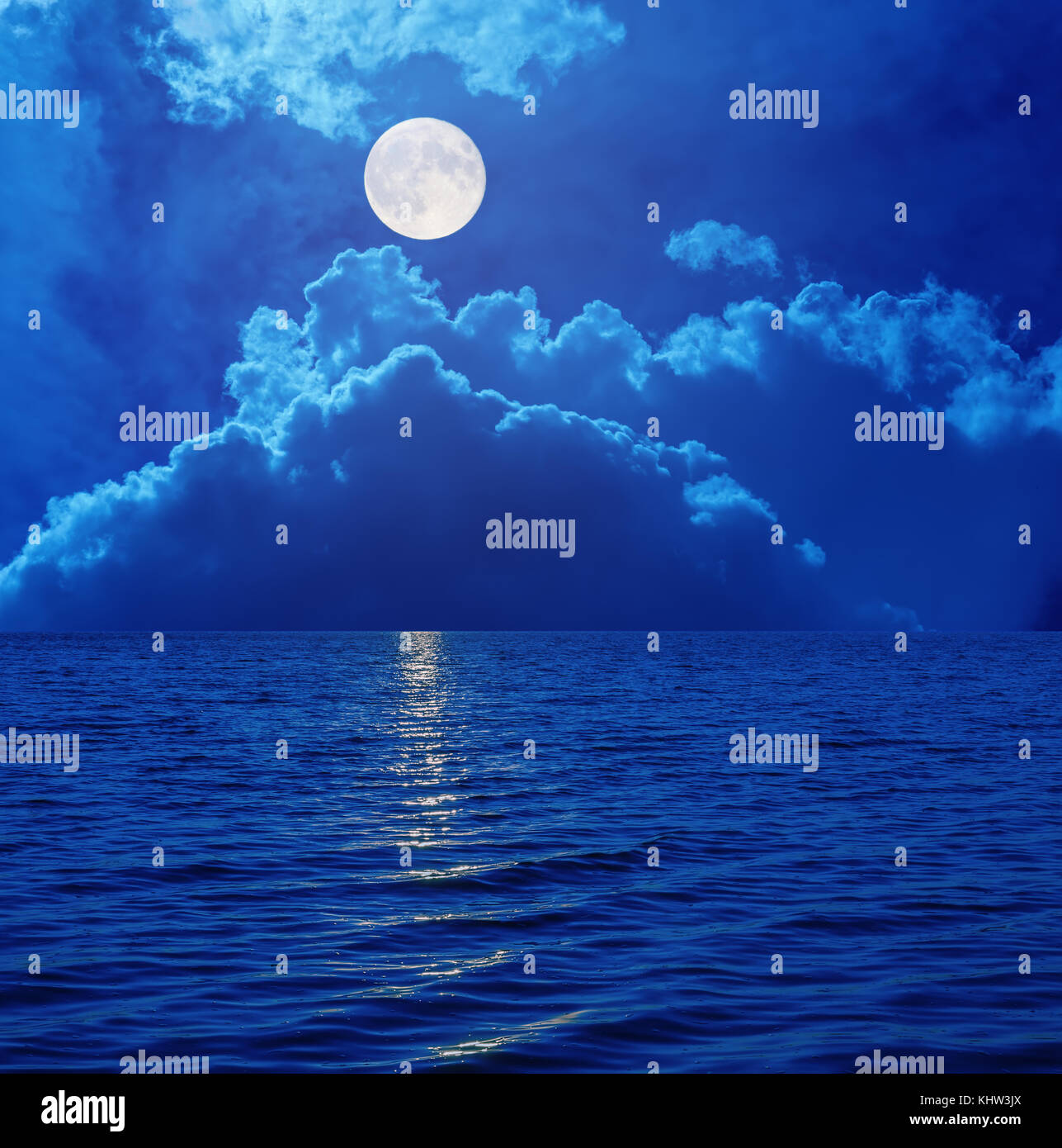 super moon in sky with clouds over sea Stock Photo - Alamy