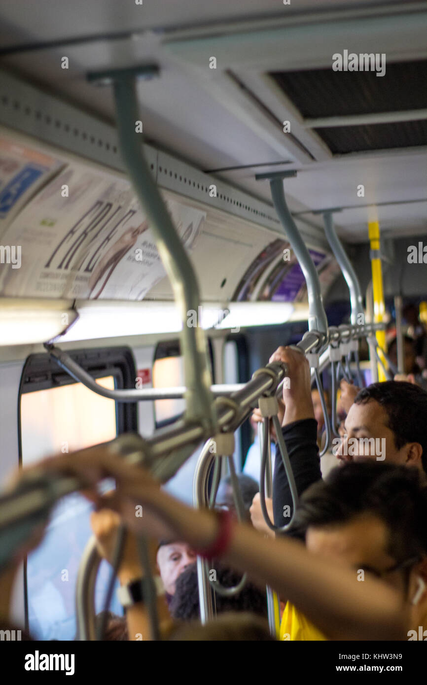Holding on tight on a crowded Chicago bus ride Stock Photo - Alamy