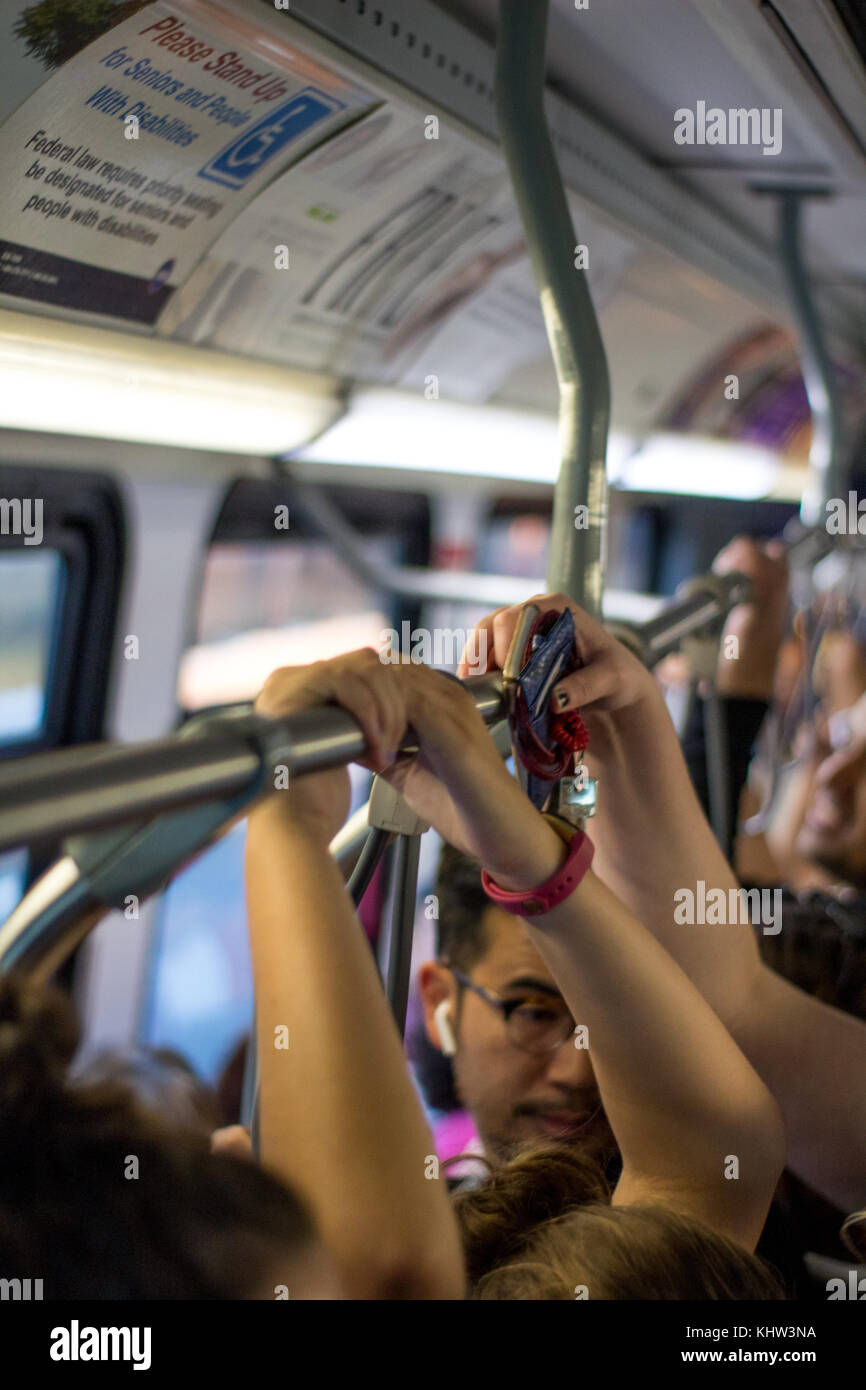 Woman standing crowded bus hi-res stock photography and images - Alamy