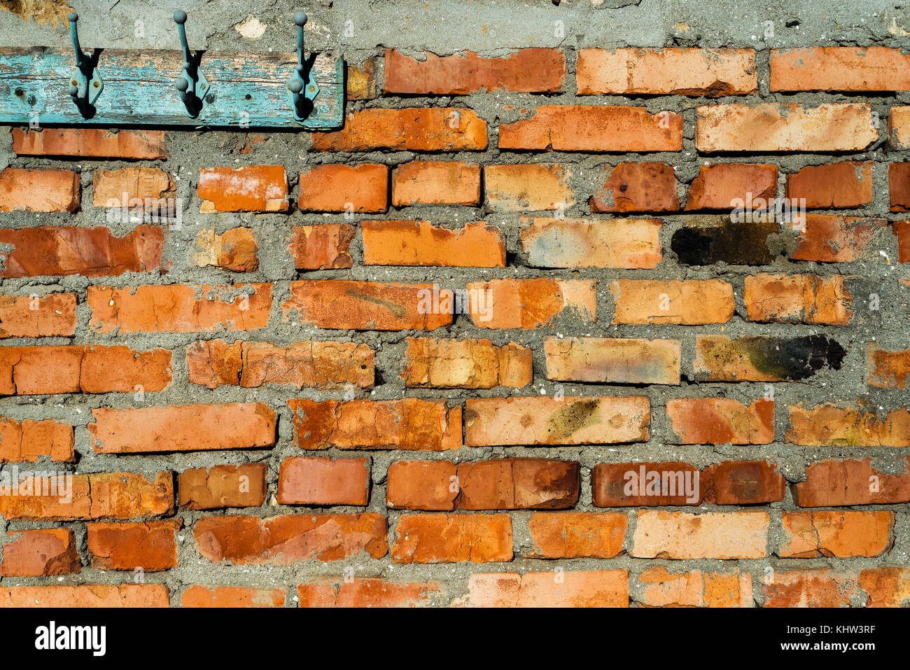 red brick wall as background and hanger in left top corner Stock Photo ...