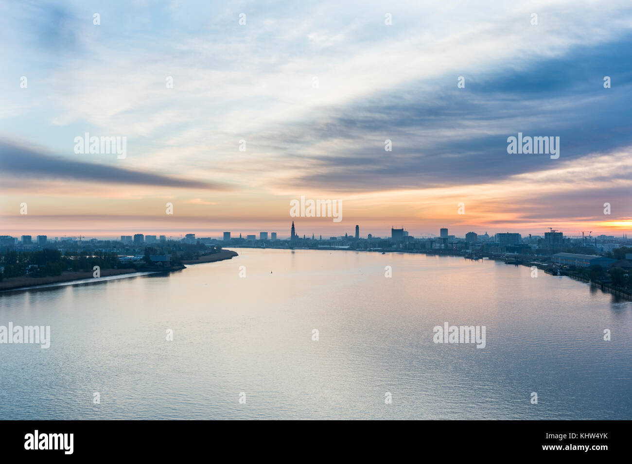 Aerial image of the Scheldt river and the city of Antwerp at sunrise ...