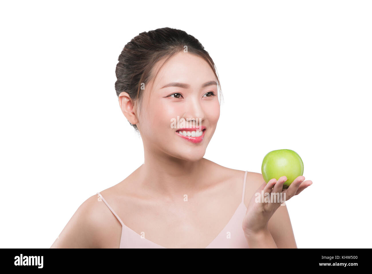 Smiling woman with healthy teeth holding green apple Stock Photo - Alamy