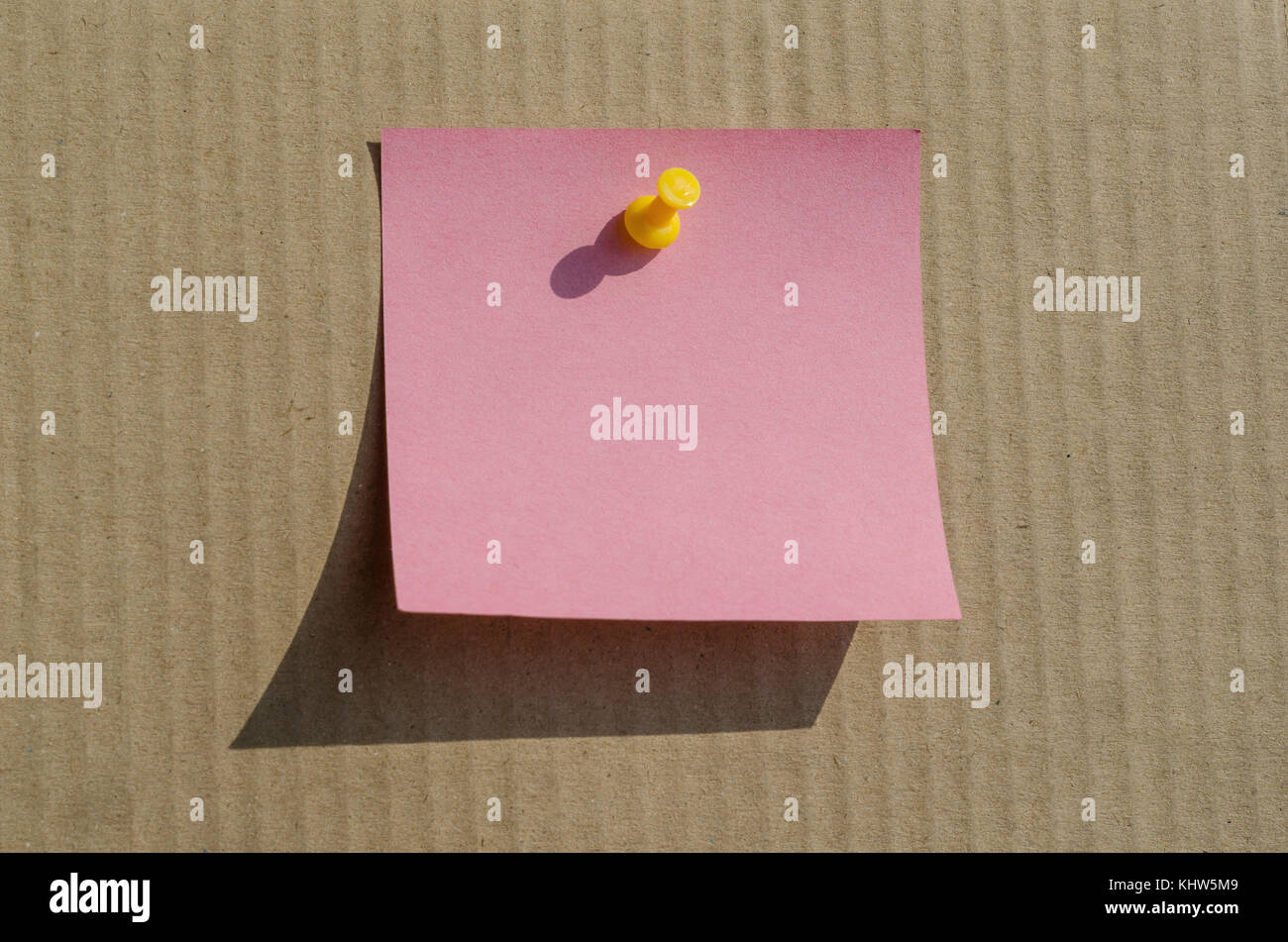 pink note on paper background with shadow Stock Photo - Alamy