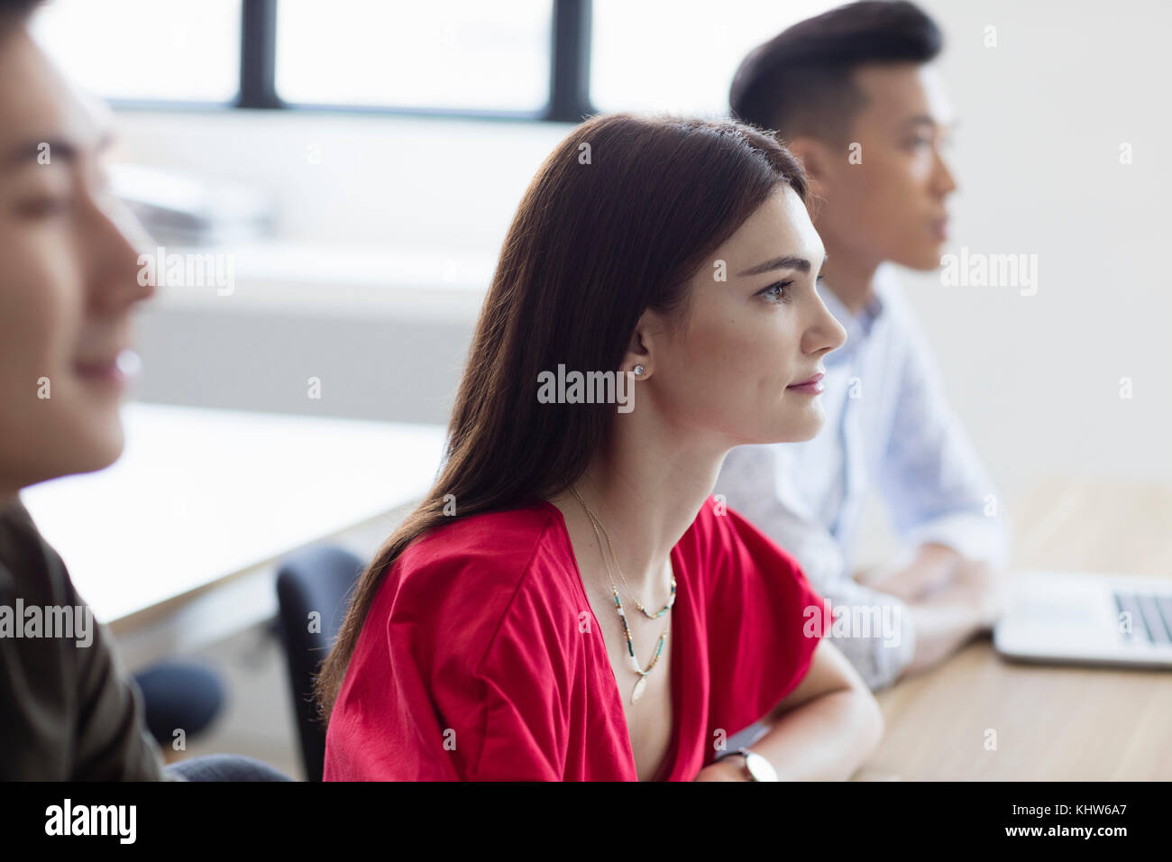 Students sitting side by side in class Stock Photo - Alamy