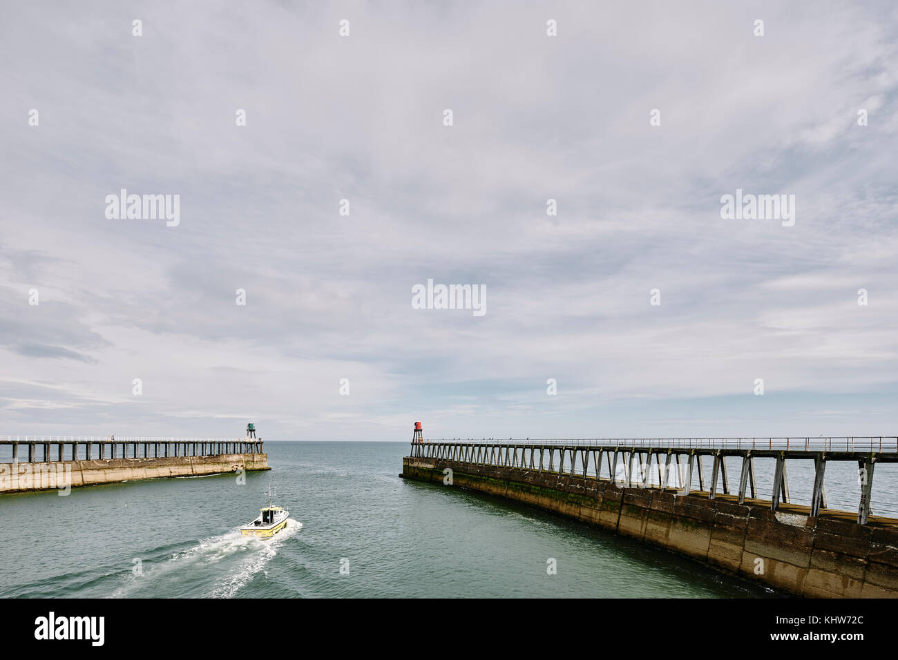 Boat heading towards sea, Whitby, North Yorkshire, England Stock Photo ...