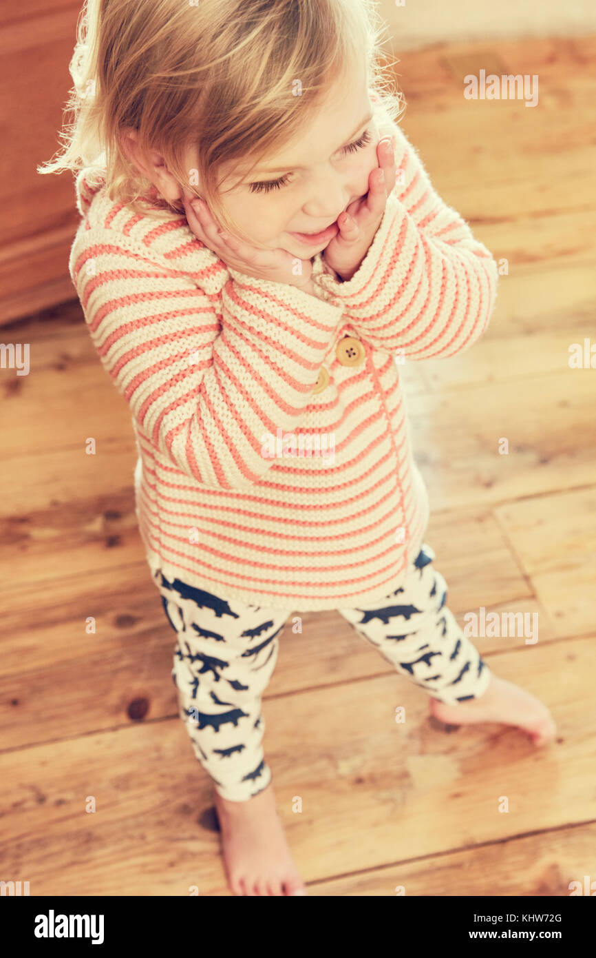 Girl with hands on cheeks hi-res stock photography and images - Alamy