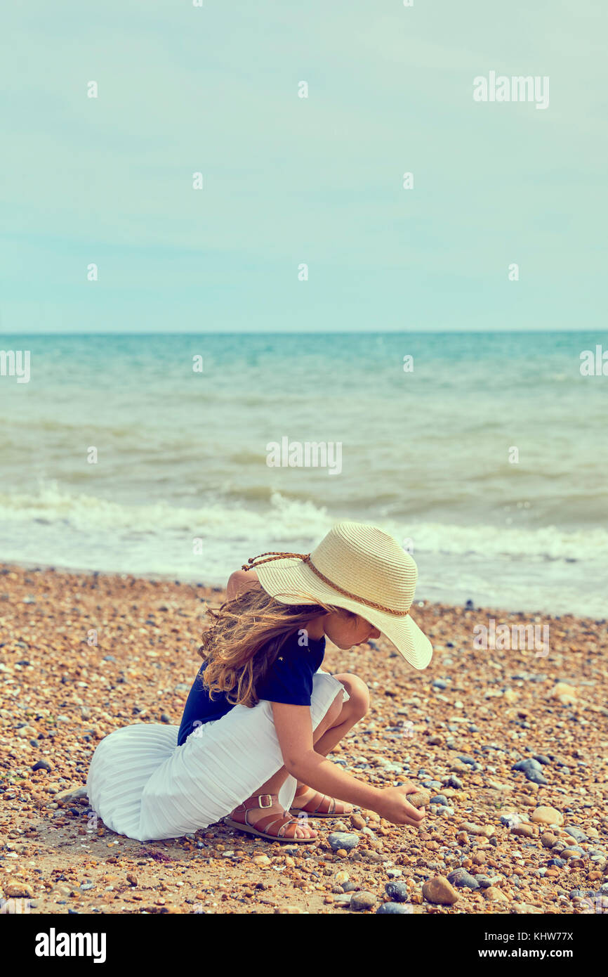 Collecting shells on beach hi-res stock photography and images - Alamy