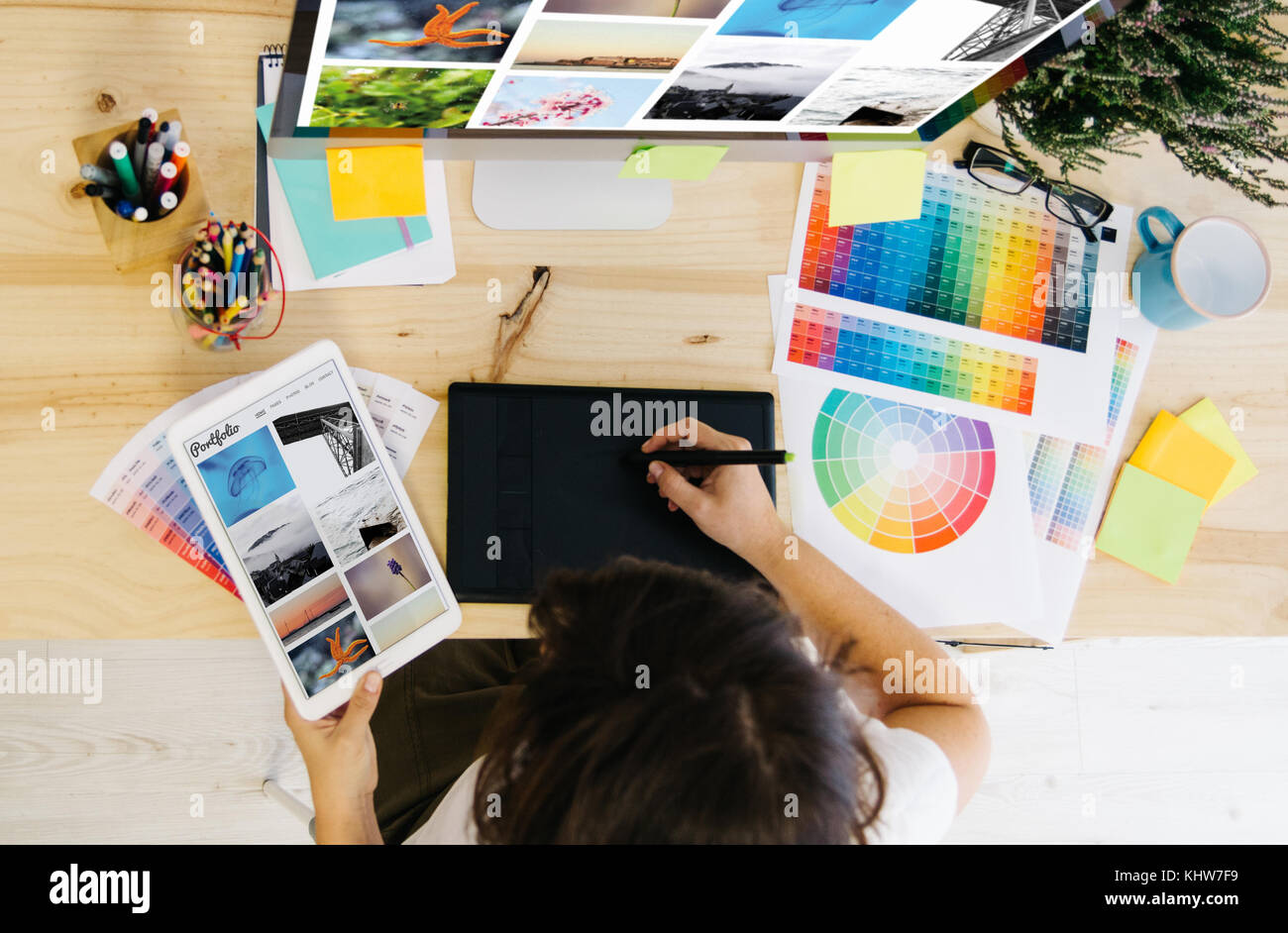 girl checking portfolio at design studio Stock Photo - Alamy