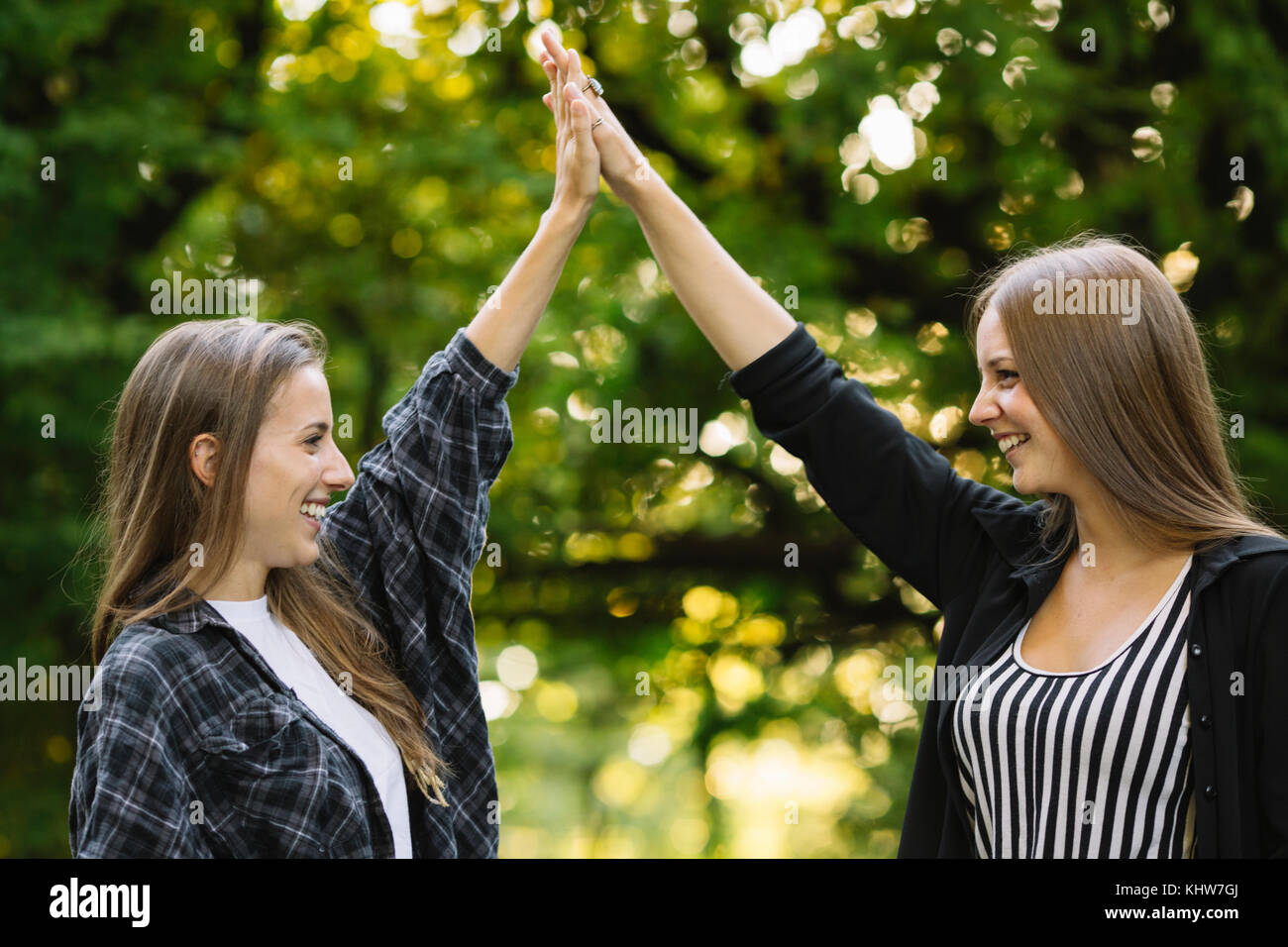 Friends High Fiving High Resolution Stock Photography and Images - Alamy
