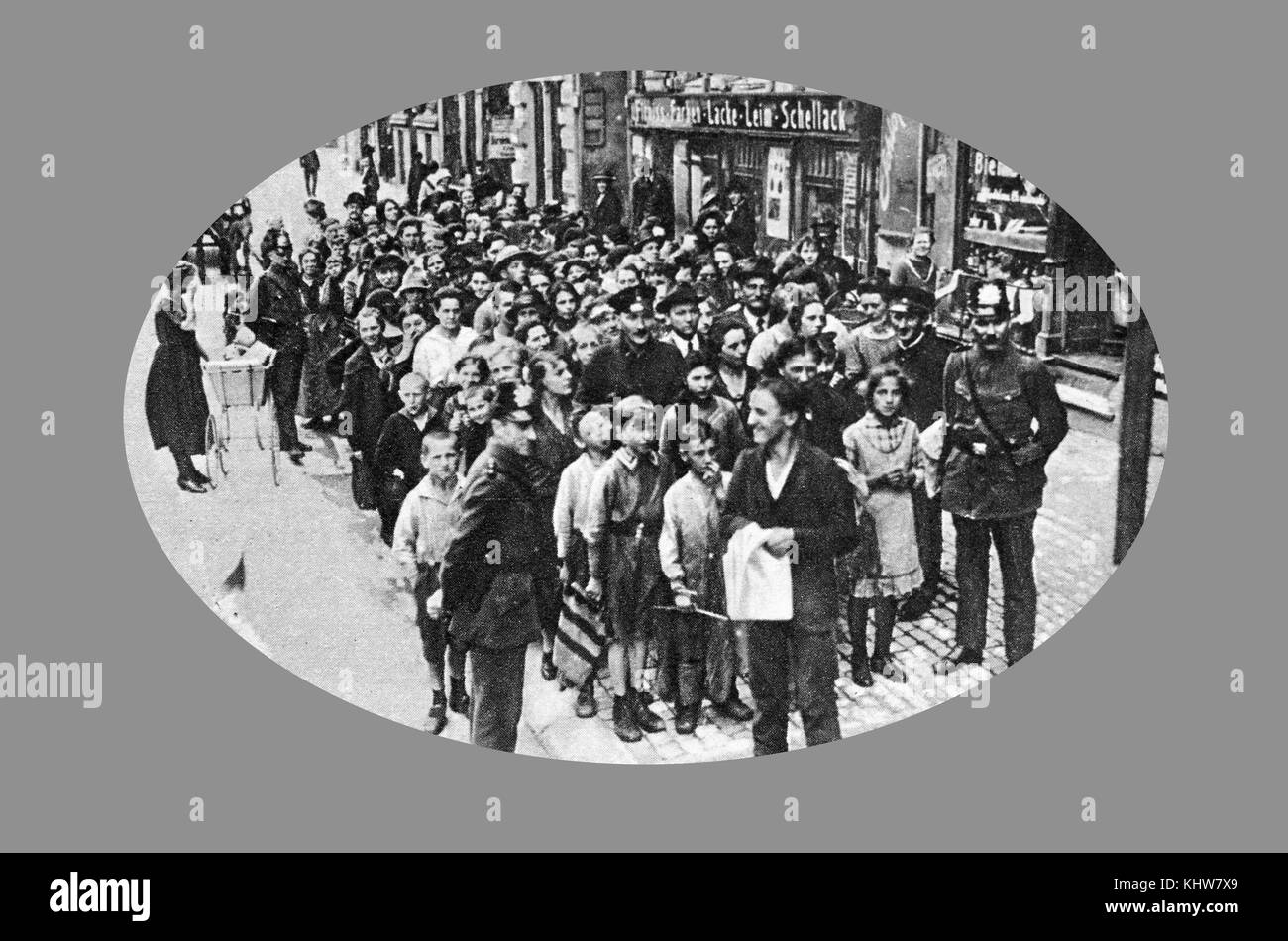 Photograph of a typical queue under police control during food ...