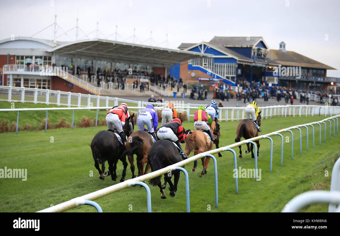 Horses go past the grandstand in The Katherine Swynford Handicap ...