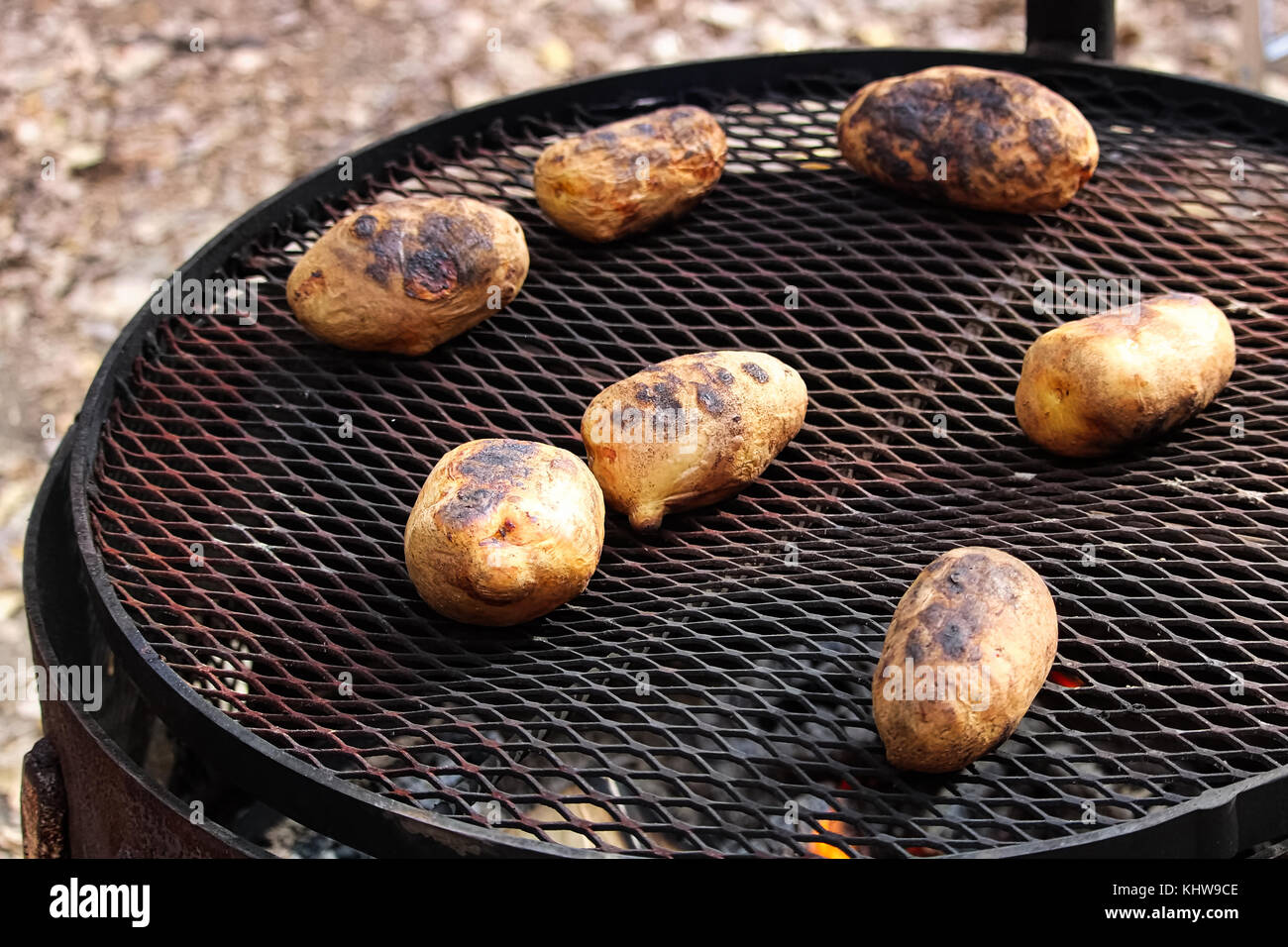 Cooking potatoes on open fire hi-res stock photography and images - Alamy