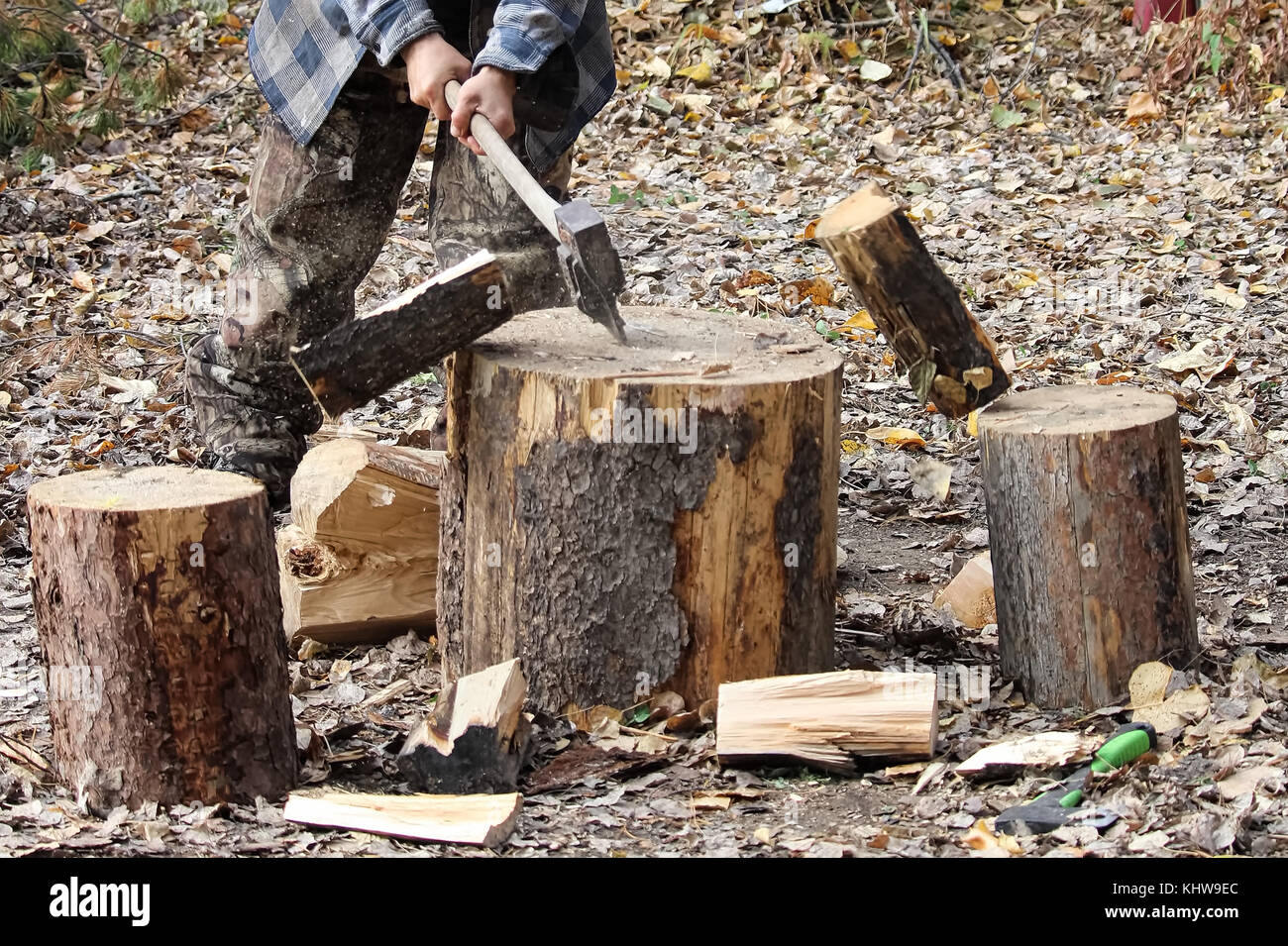 Action shot of wood being split and flying away from the stump Stock ...