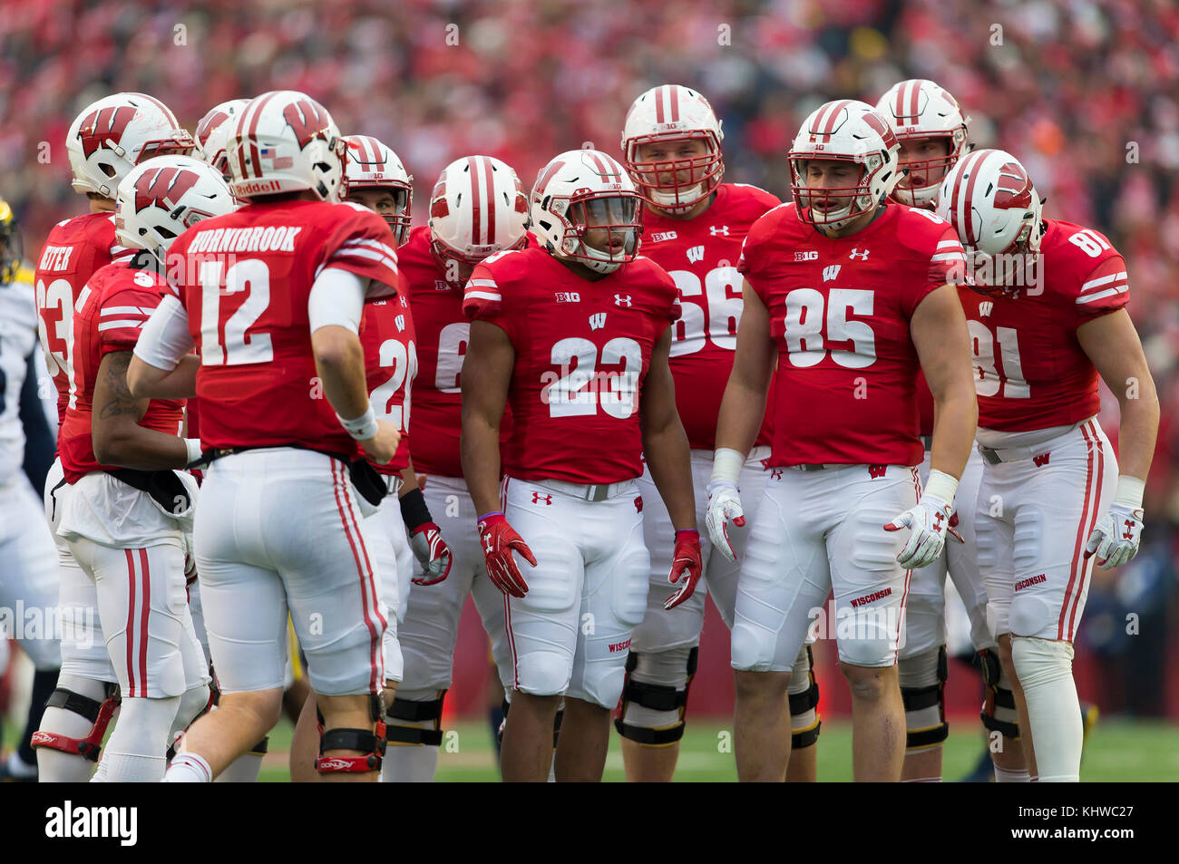 Madison, WI, USA. 18th Nov, 2017. Badger offense huddles up during the ...