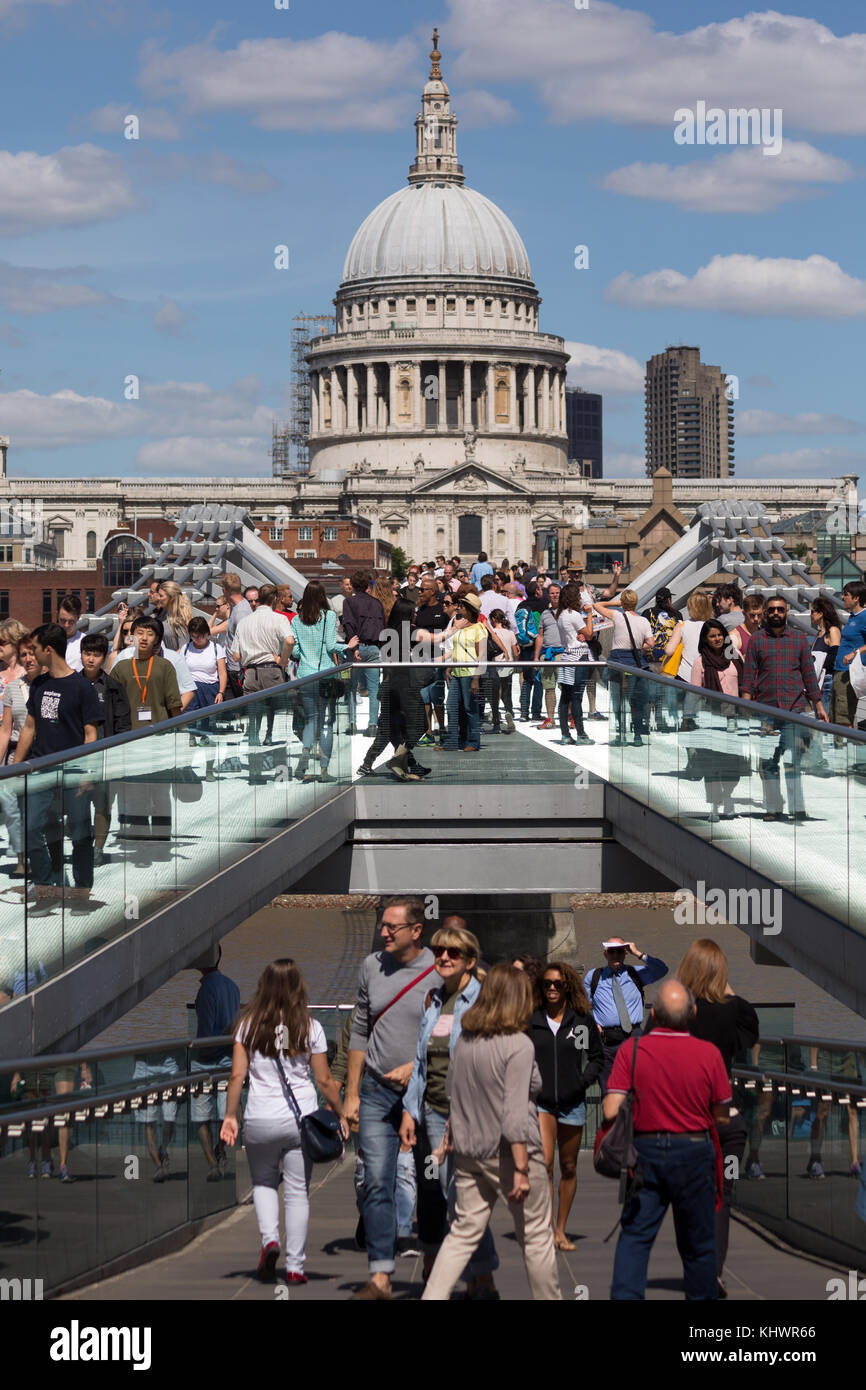 People crossing Millennium Bridge, London, UK Stock Photo - Alamy