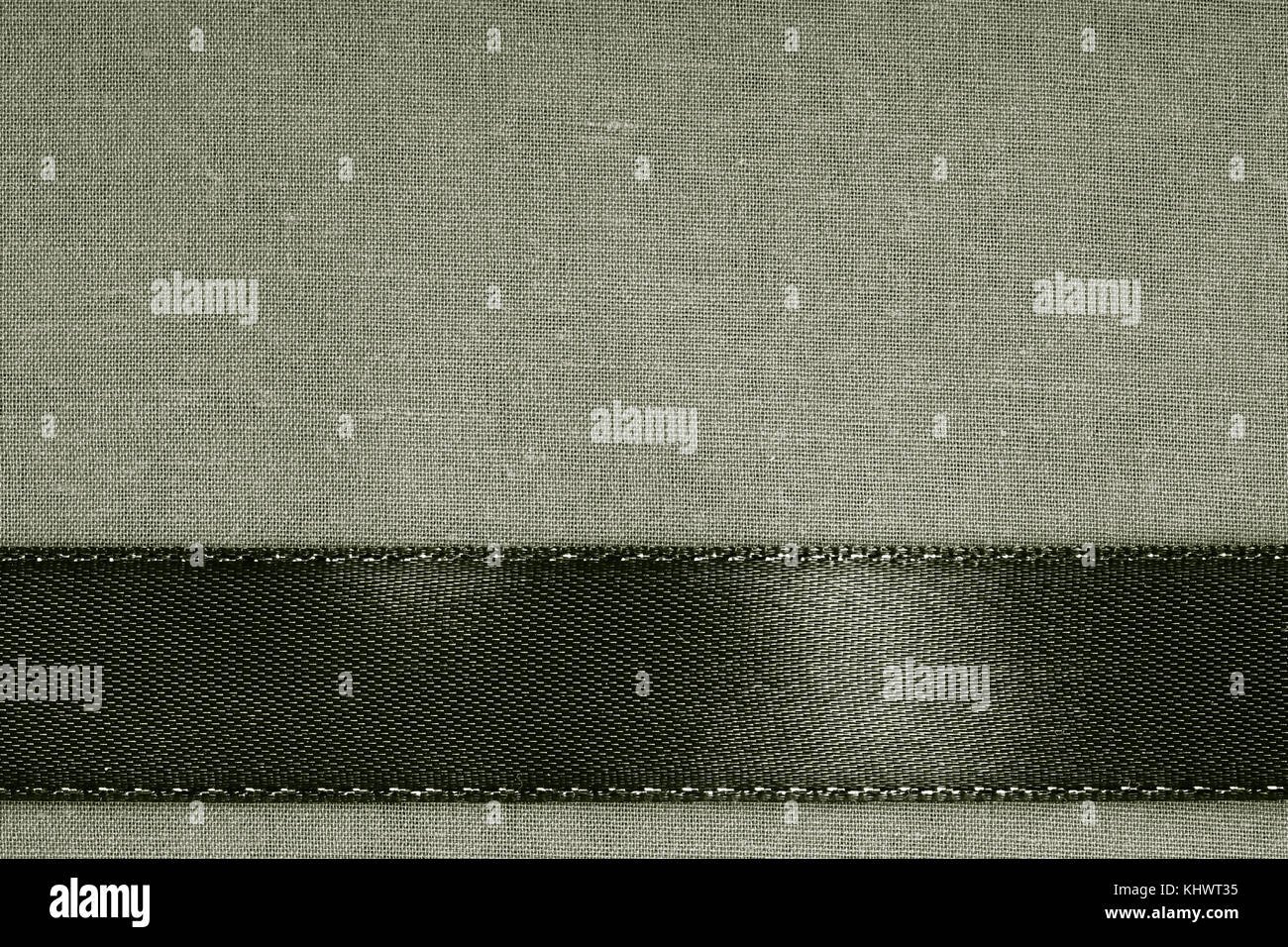 vintage background. Black ribbon on gray fabric cloth texture with copy ...