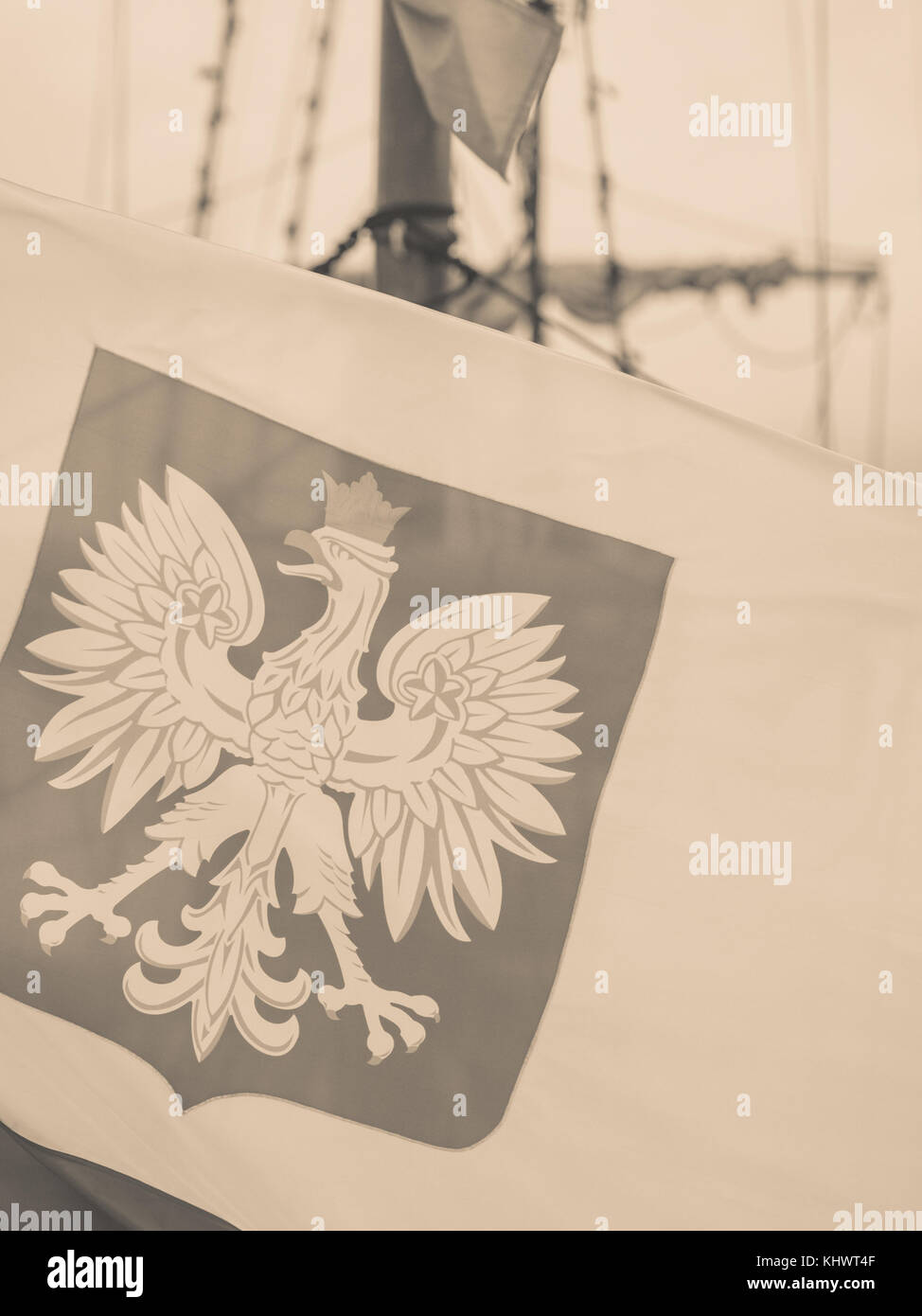 Closeup of polish national flag with eagle emblem on ship in marine ...