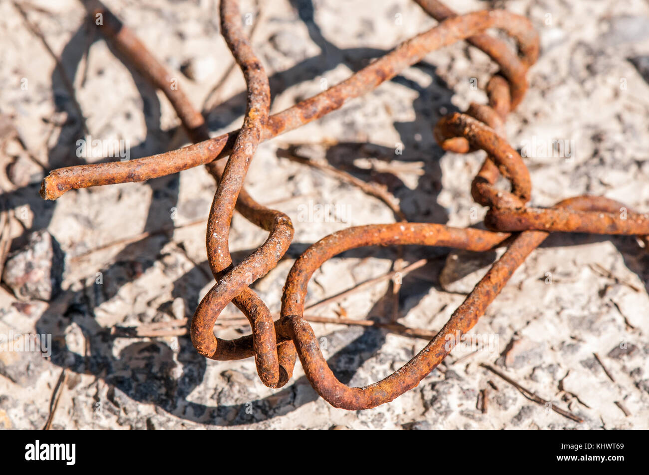 close-up view of a shaped rusty wire on the floor Stock Photo - Alamy