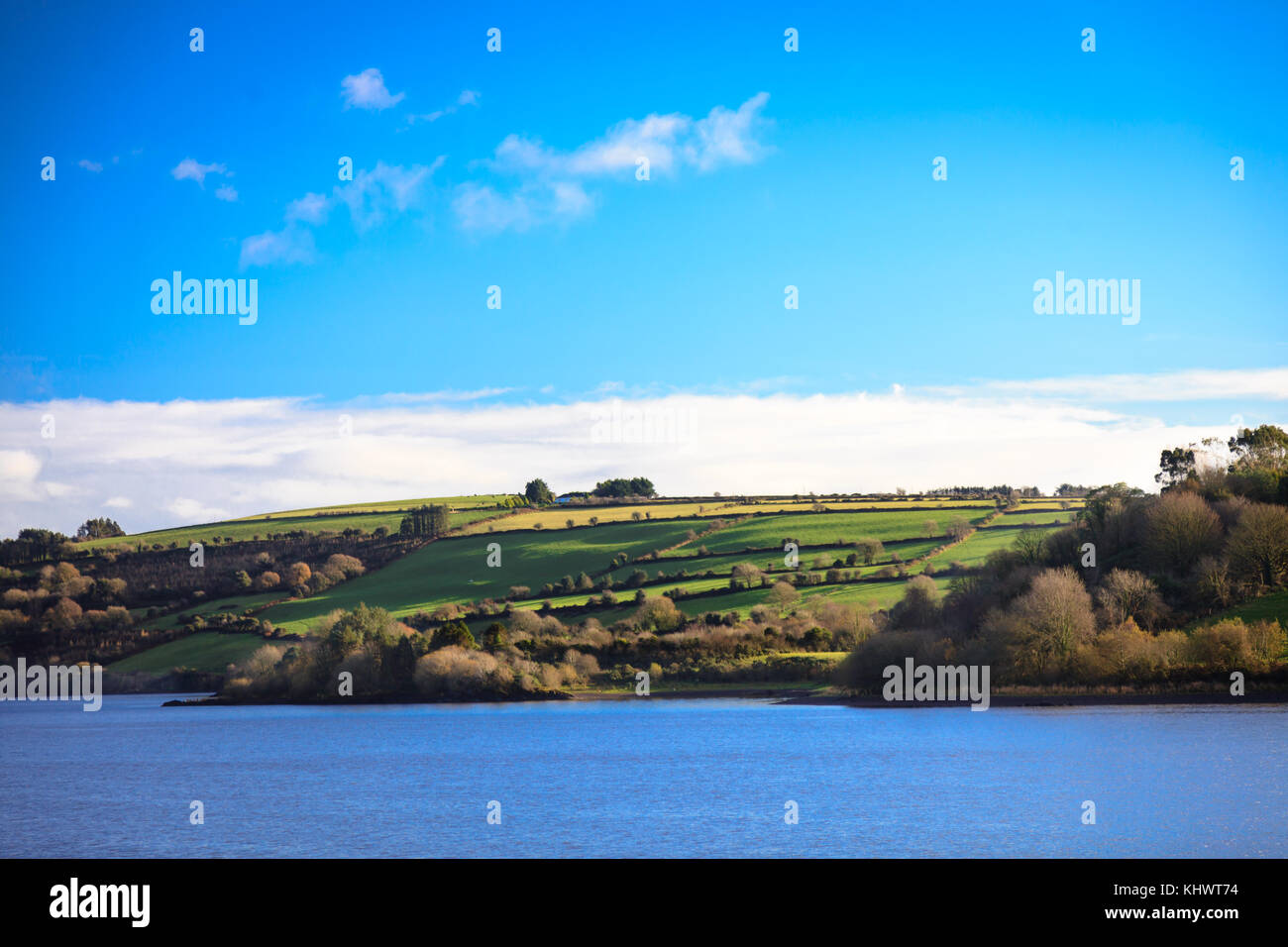 beautiful irish landscape green meadows at calm river Co.Cork, Ireland ...