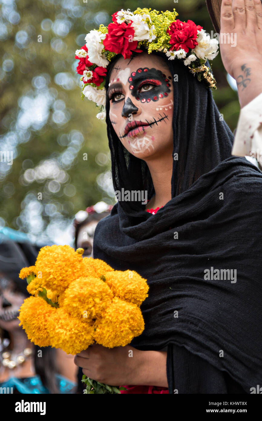 A young woman dressed in La Calavera Catrina costume during the Day of ...
