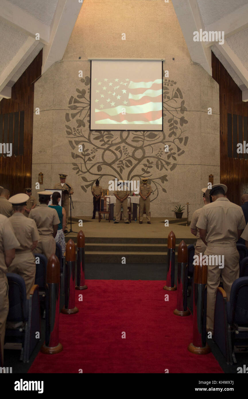 SANTA RITA, Guam (Nov. 17, 2017) Sailors and guests bow their heads in ...