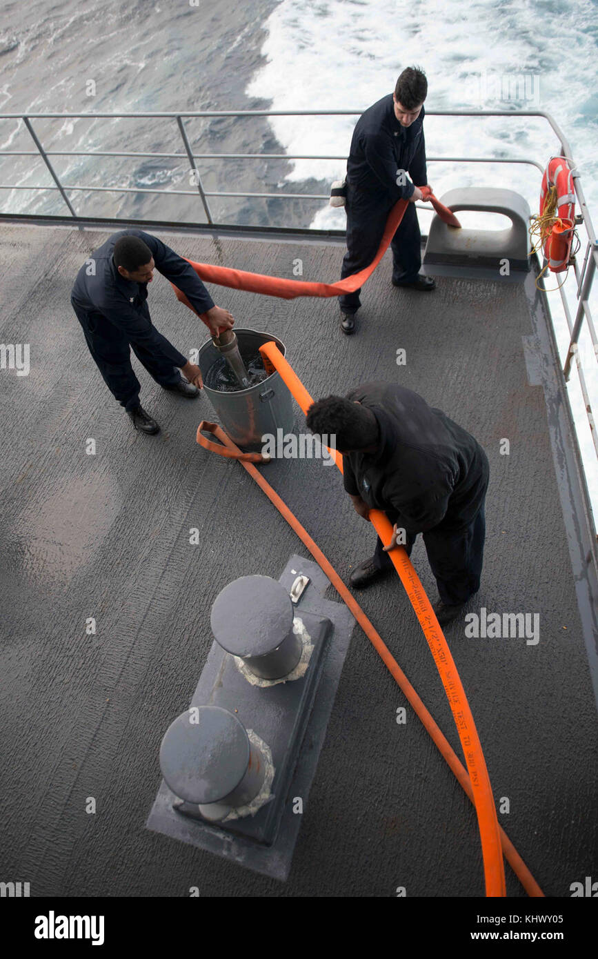 PACIFIC OCEAN (Nov. 15, 2017) Sailors set up a peri-jet eductor pump ...