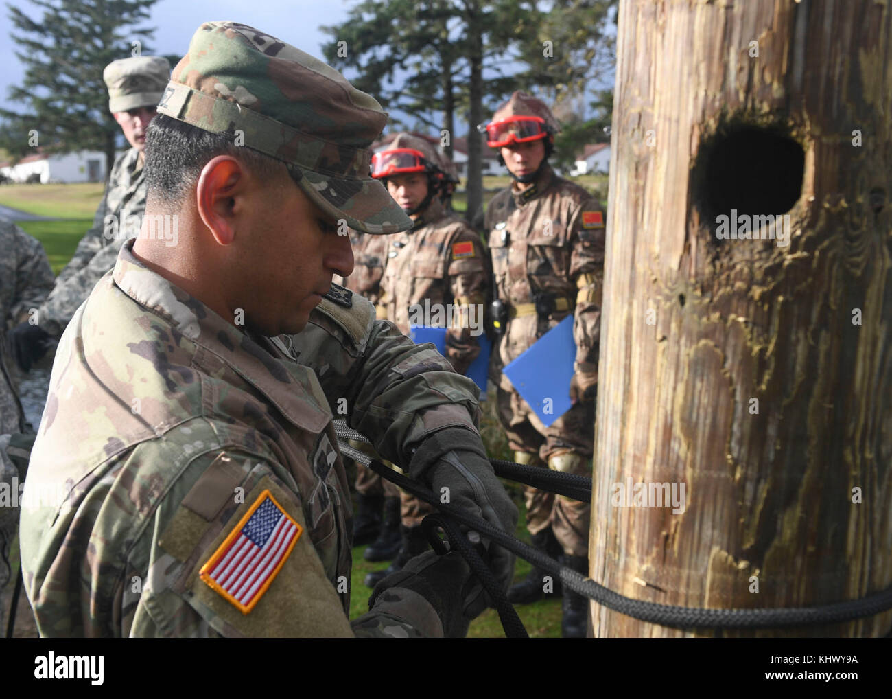 Participants set up a one-rope bridge during the 2017 U.S. – China ...