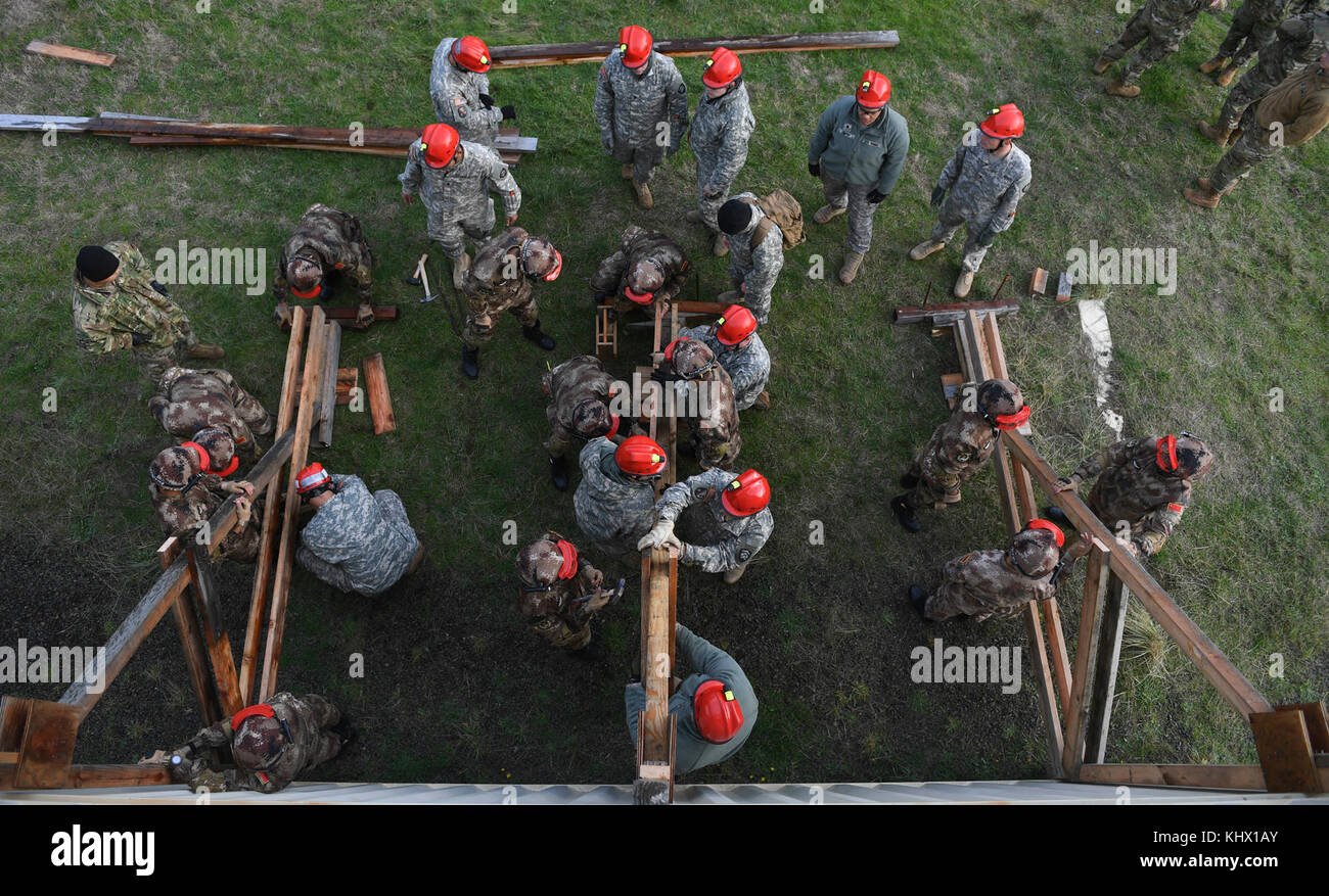 Participants apply struts to a building during the 2017 U.S. – China ...