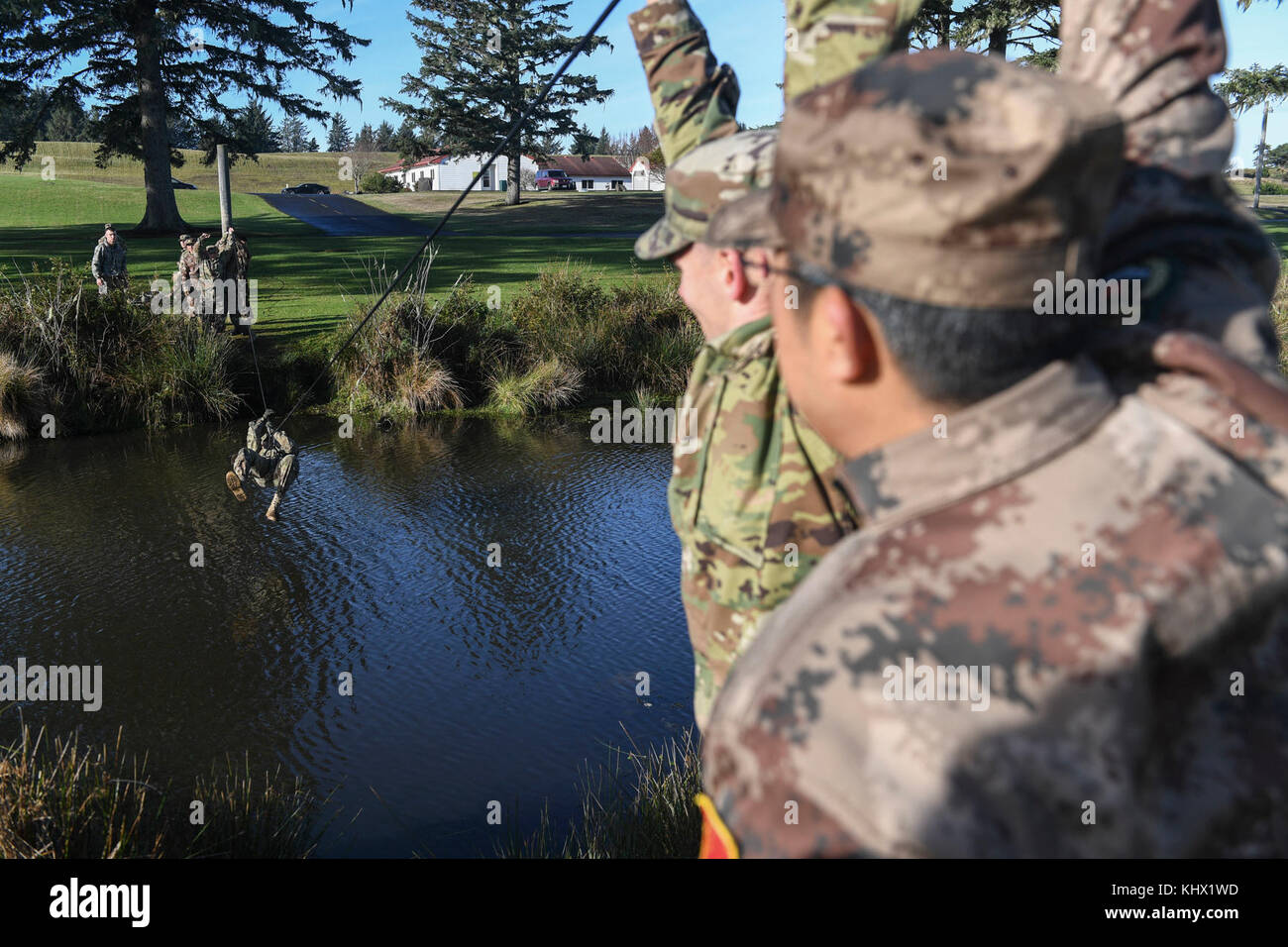 Participants use a one-rope bridge during the 2017 U.S. – China ...