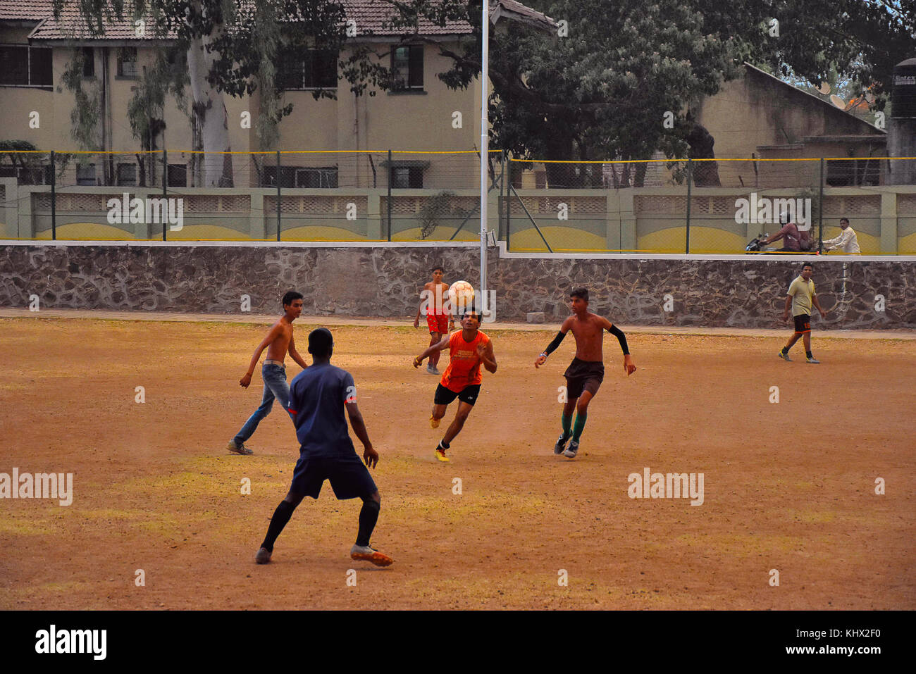 Kids play football outside ground hi-res stock photography and images ...