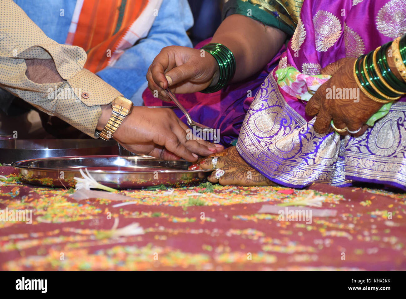 Bride and groom at Haldi ceremony a couple days before a Hindu wedding ...