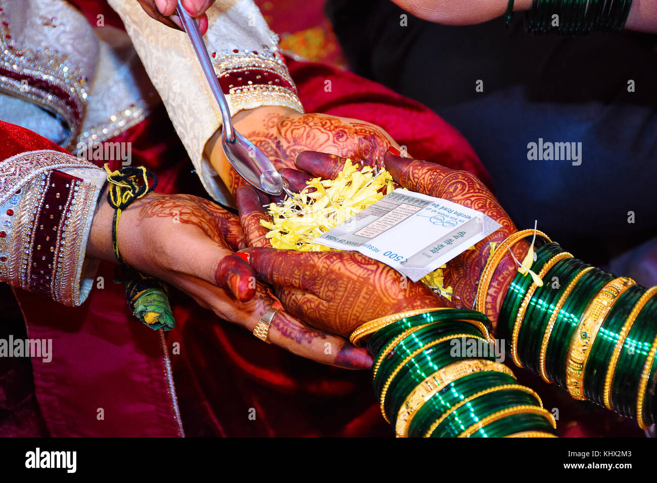 Bride and groom at Haldi ceremony a couple days before a Hindu wedding ...