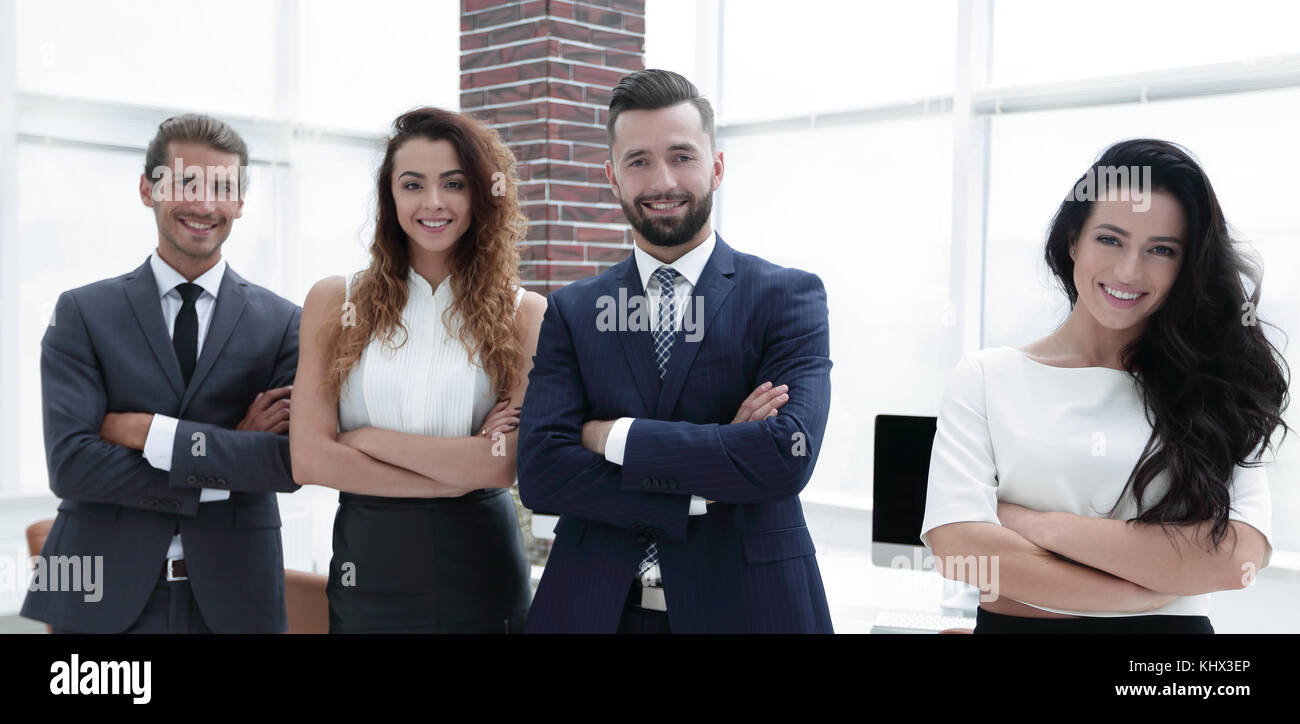 Happy smiling business team in office Stock Photo - Alamy