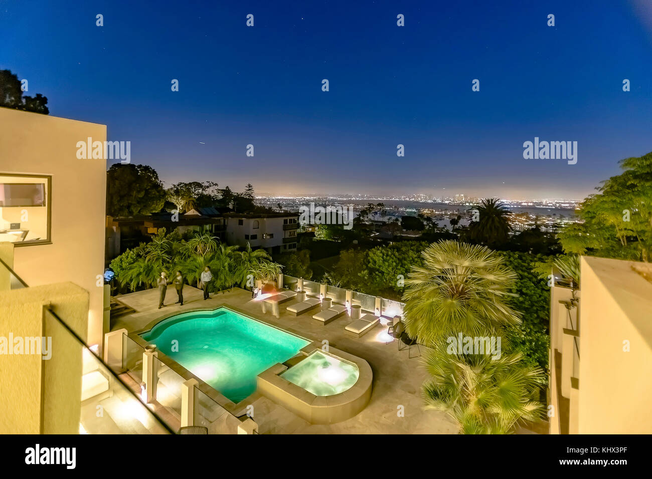 Balcony glass rail with night lighting of back room from a luxury ...