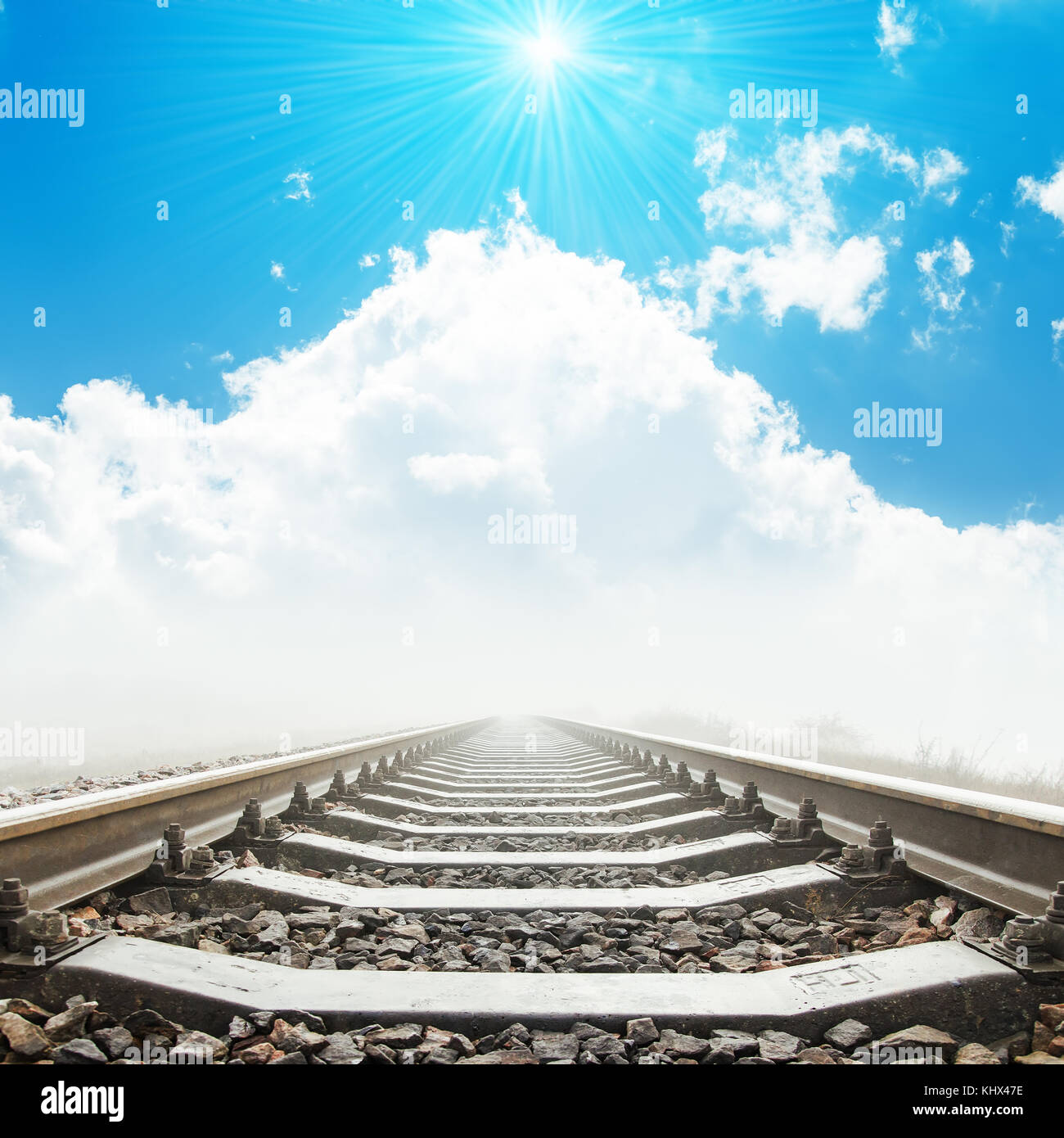 railway to heaven in clouds and sun over it Stock Photo - Alamy