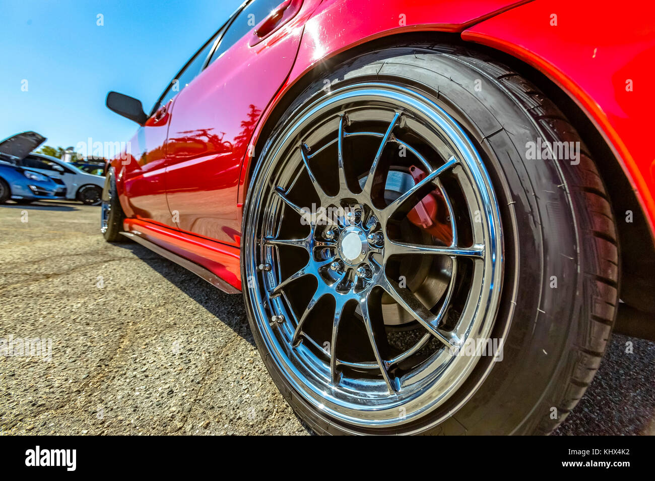 Close-up photos of red car with chrome wheel rims. Orange county ...