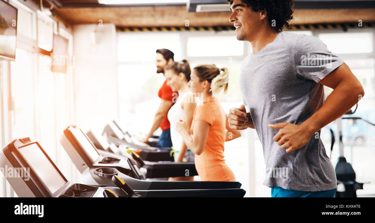 Picture of cheerful fitness team in gym Stock Photo - Alamy