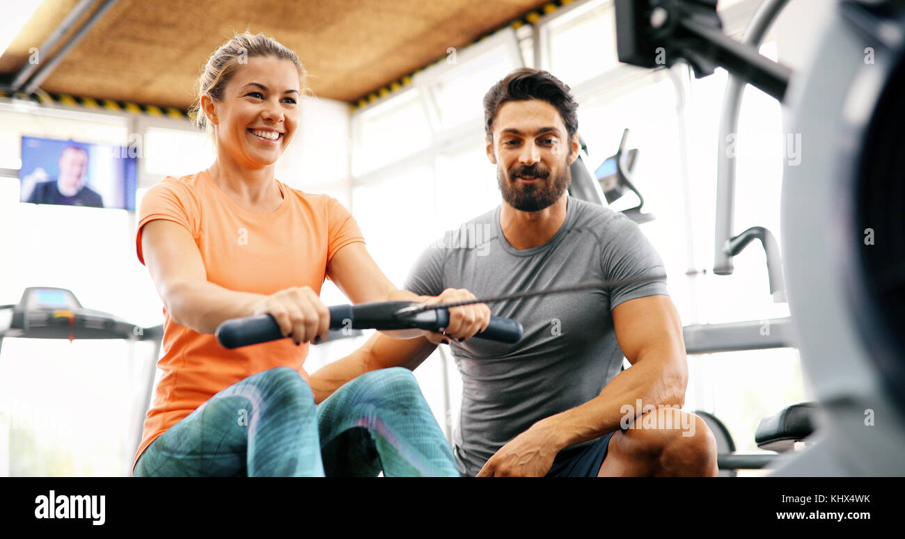 Personal trainer helping Stock Photo - Alamy