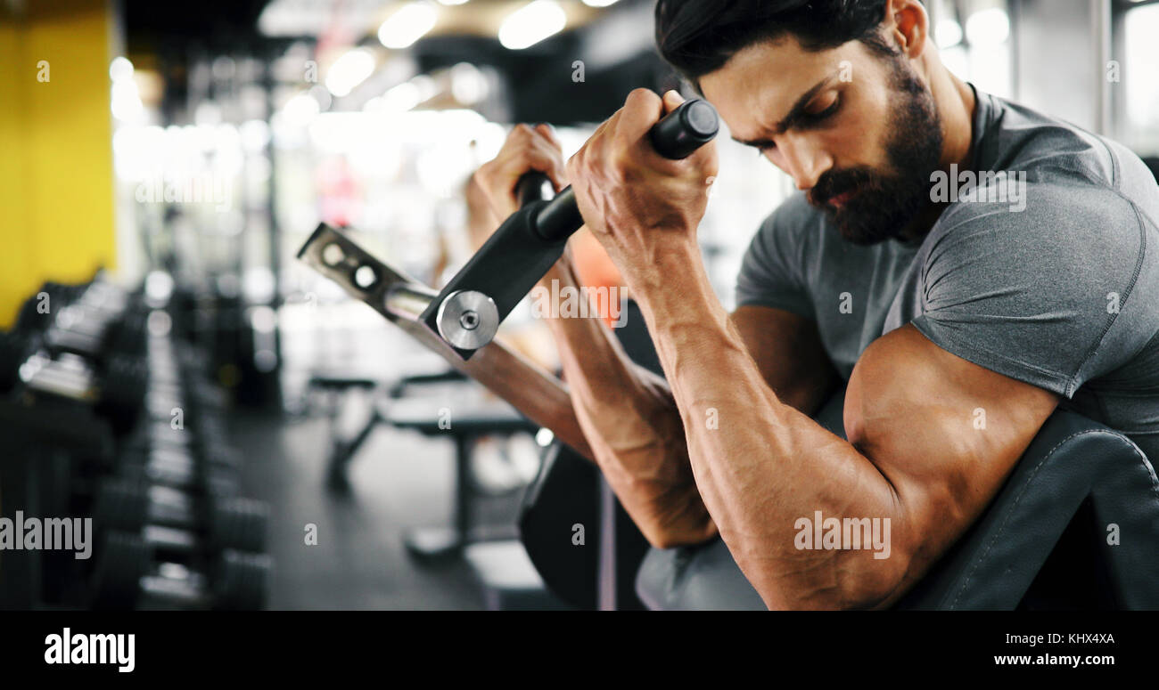 Athletic young man exercises hi-res stock photography and images - Alamy