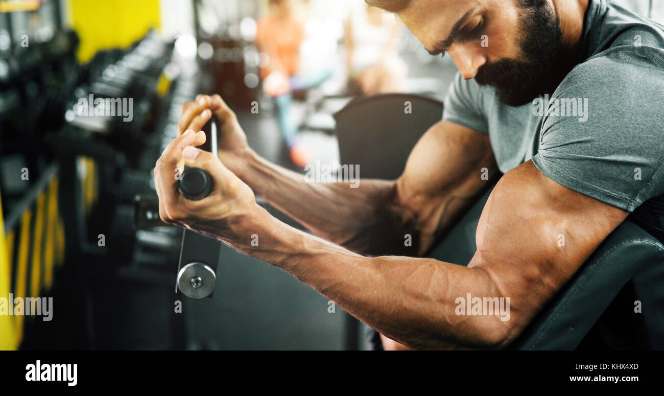 Strong ripped man training in gym Stock Photo - Alamy