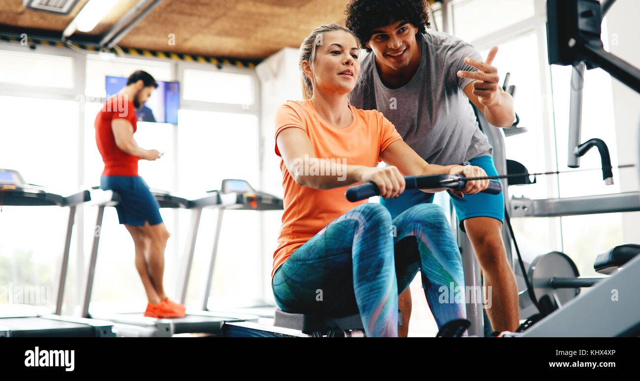 Personal trainer helping Stock Photo - Alamy