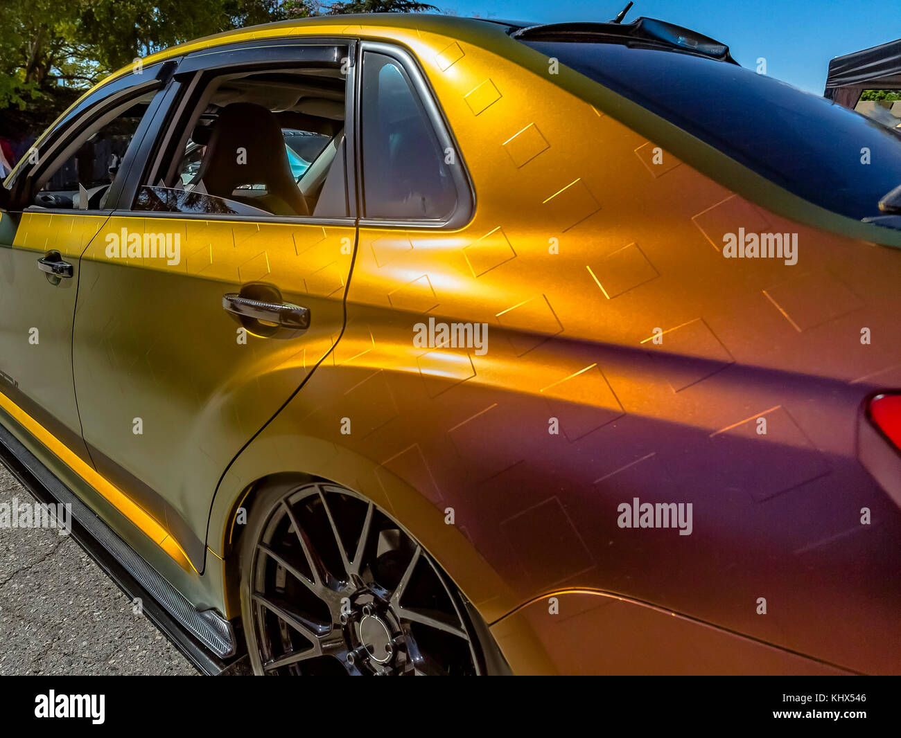 Metallic orange car from the back driver's side passenger. Custom cars ...