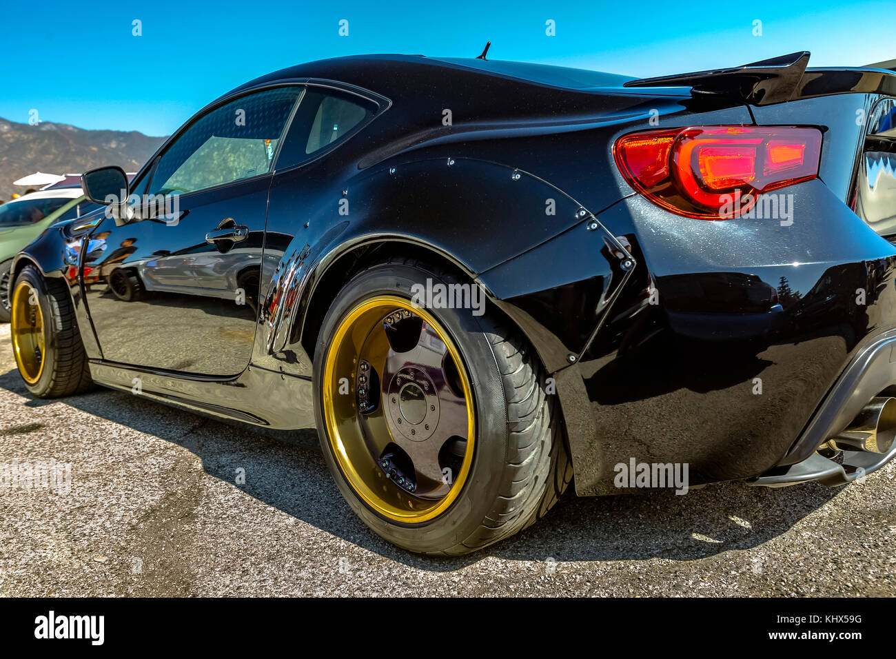 Perspective view of a black car from the back driver side. Custom cars ...